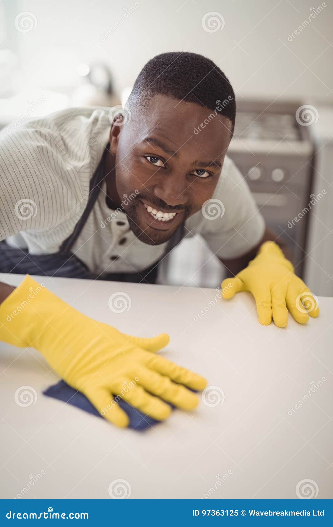 Smiling Man Cleaning the Kitchen Worktop Stock Image - Image of leisure ...