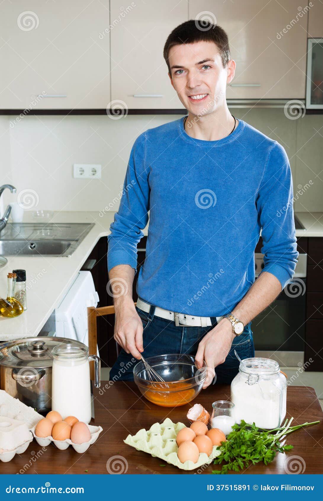 Smiling Man Cooking in Kitchen Stock Image - Image of domestic, eggs ...