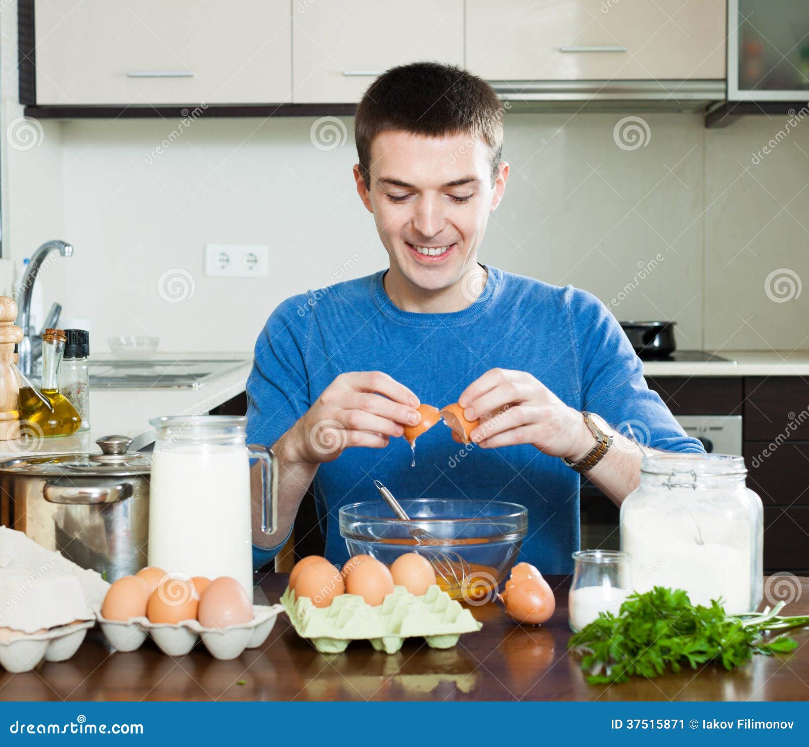 Smiling man cooking omlet stock image. Image of person - 37515871