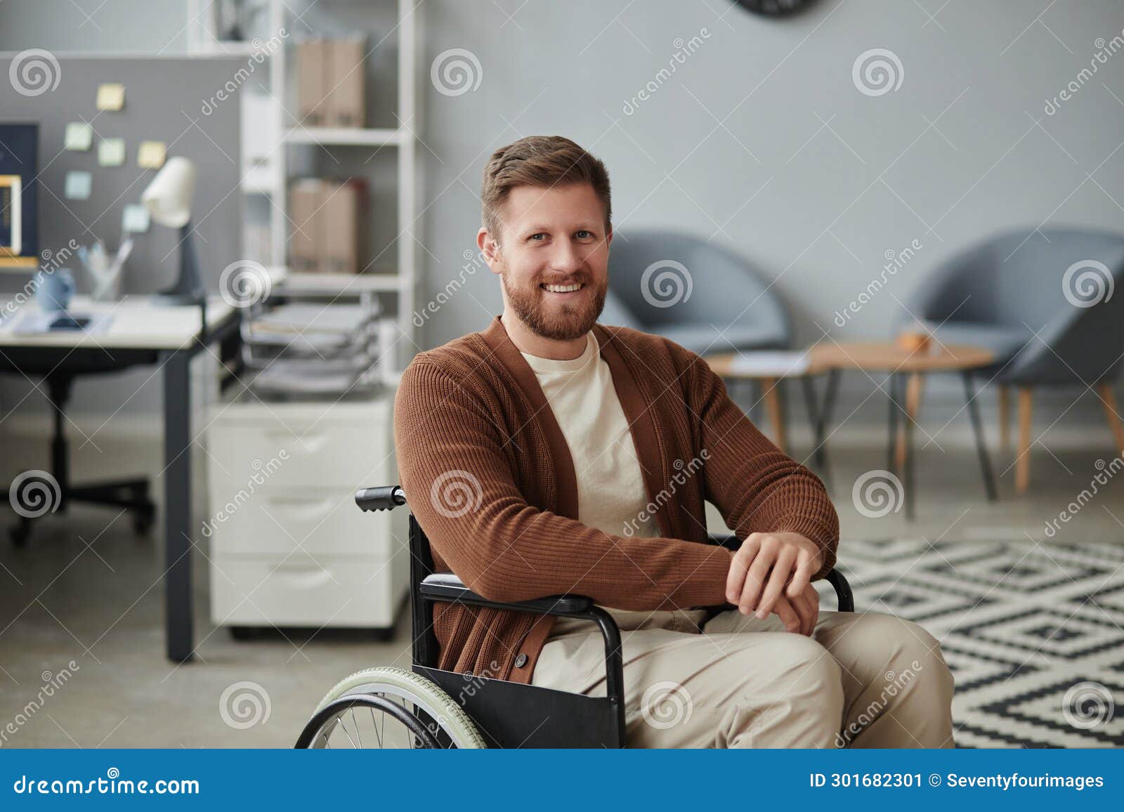 Smiling Man with Disability Using Wheelchair Posing in Office Setting ...
