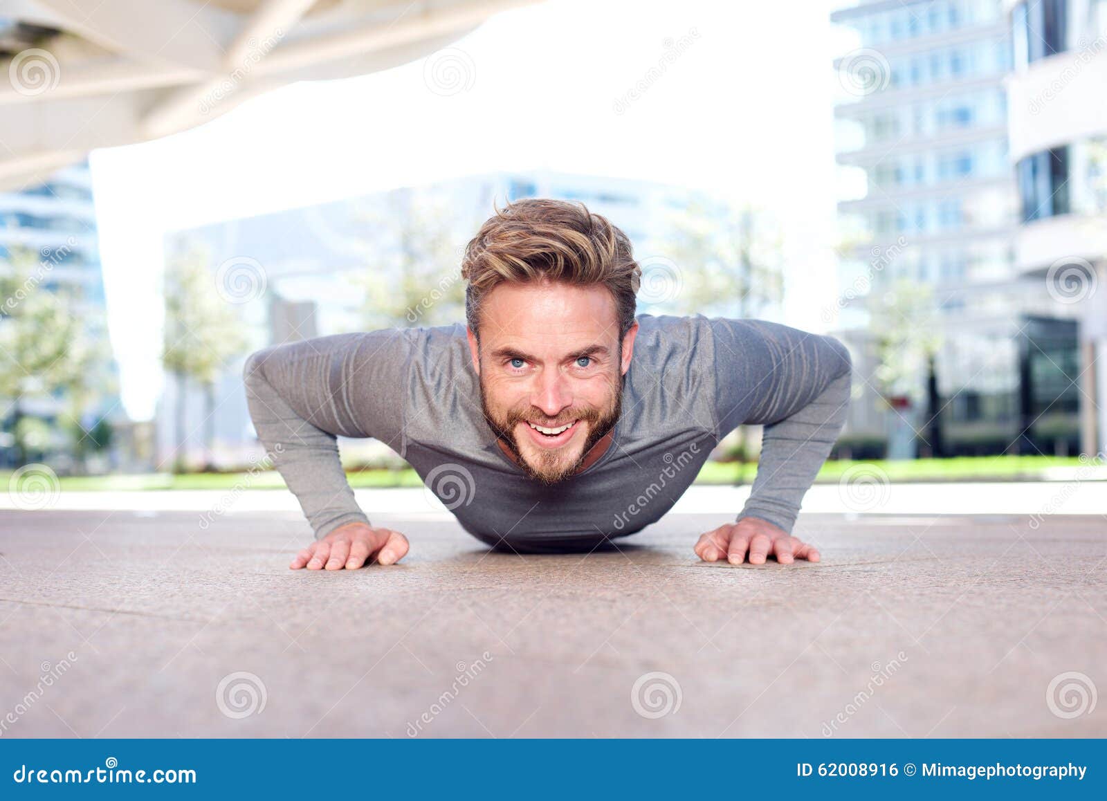 Smiling Man Doing Push Ups Outdoors in the City Stock Photo - Image of ...