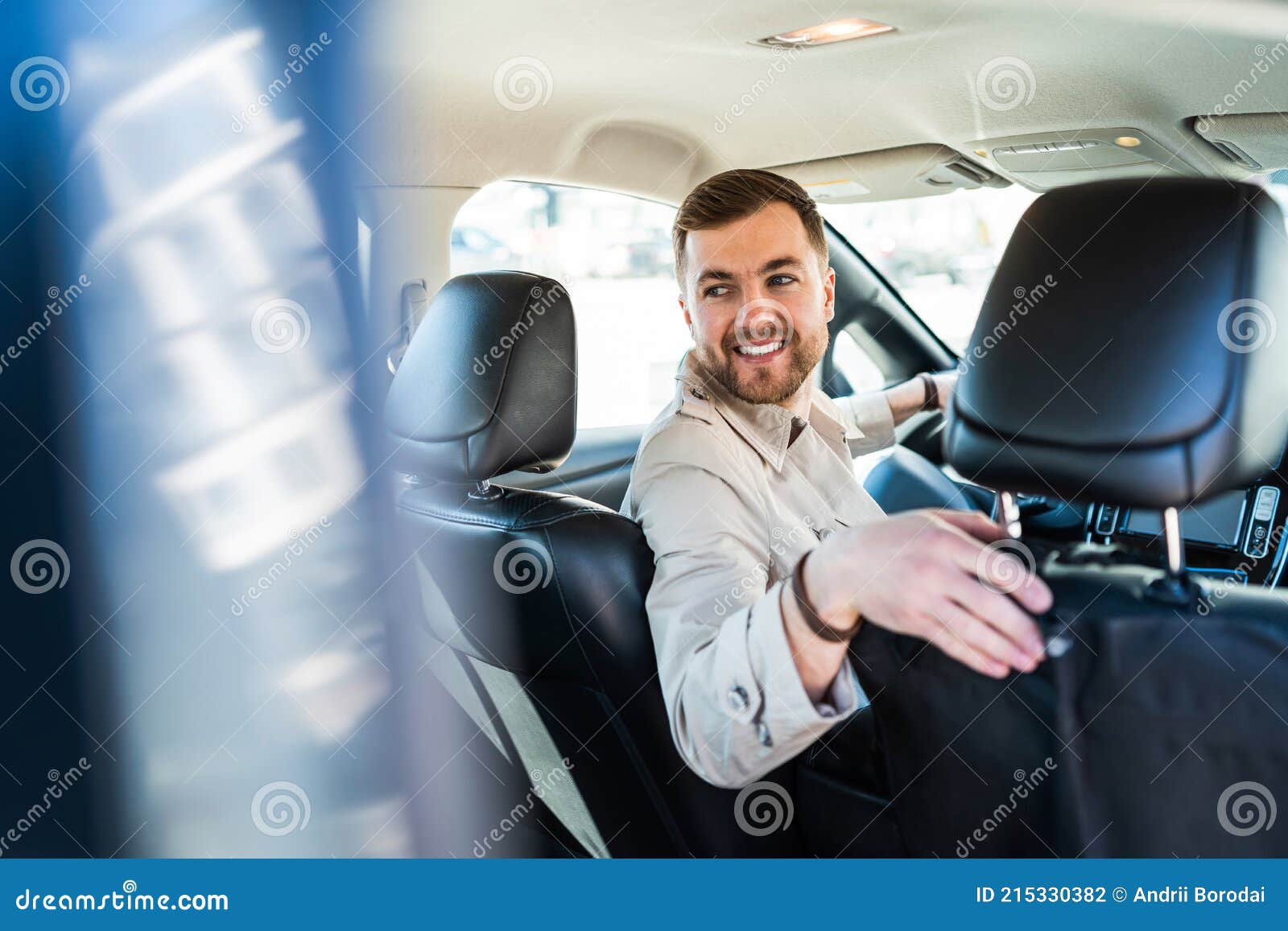 Smiling Man Driving in Reverse on Car. Stock Photo - Image of male ...