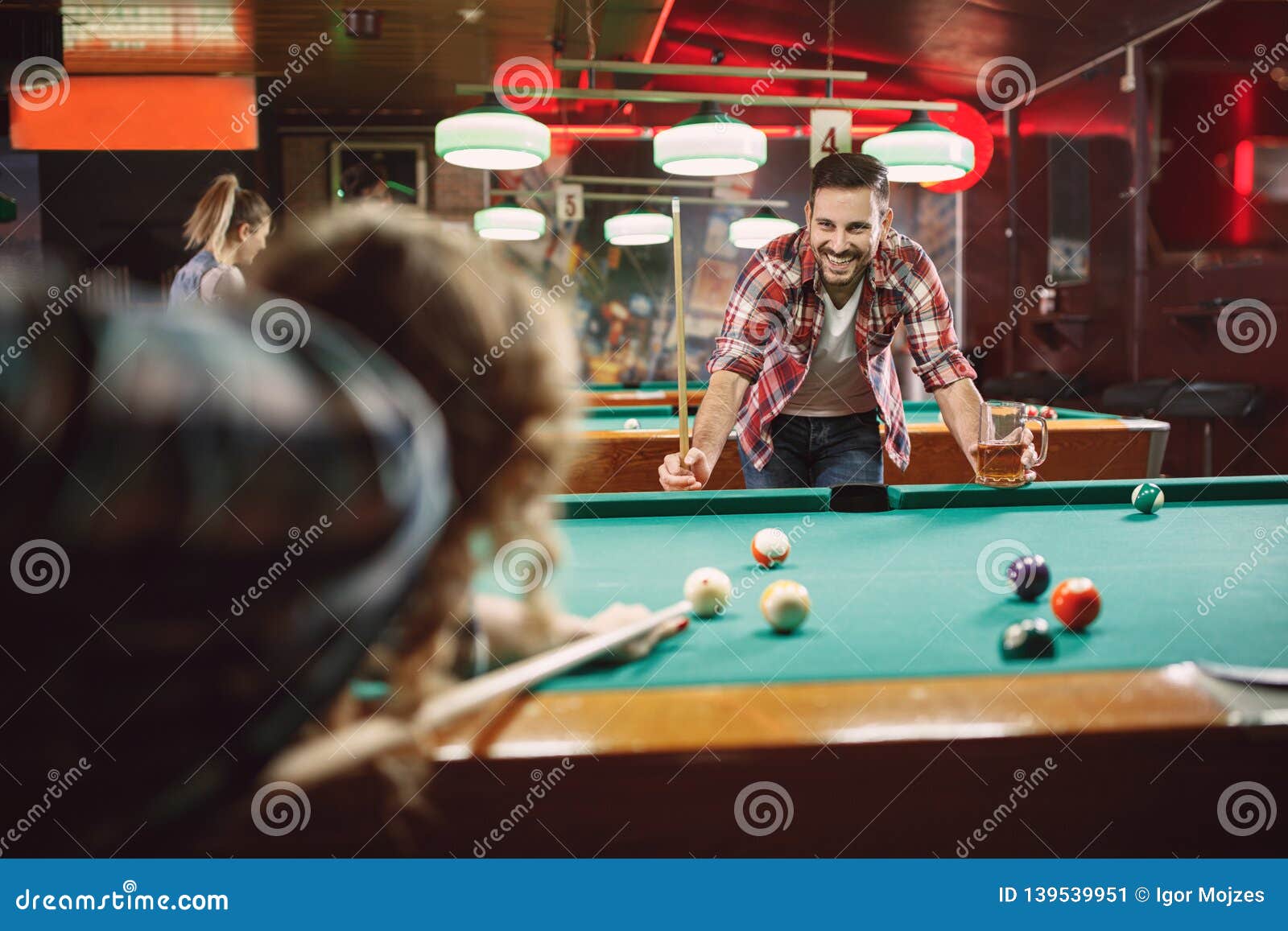 Smiling Man Enjoying Playing Pool with Friends Stock Image - Image of ...