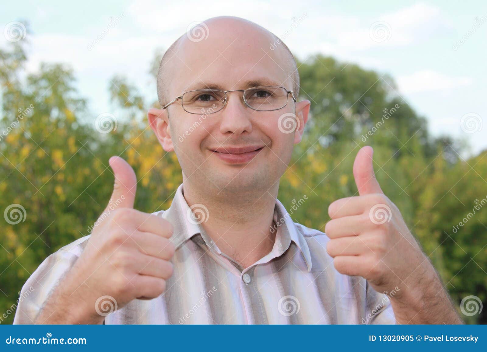 Smiling Man in Fall Park with Thumbs Up Gestures Stock Image - Image of ...