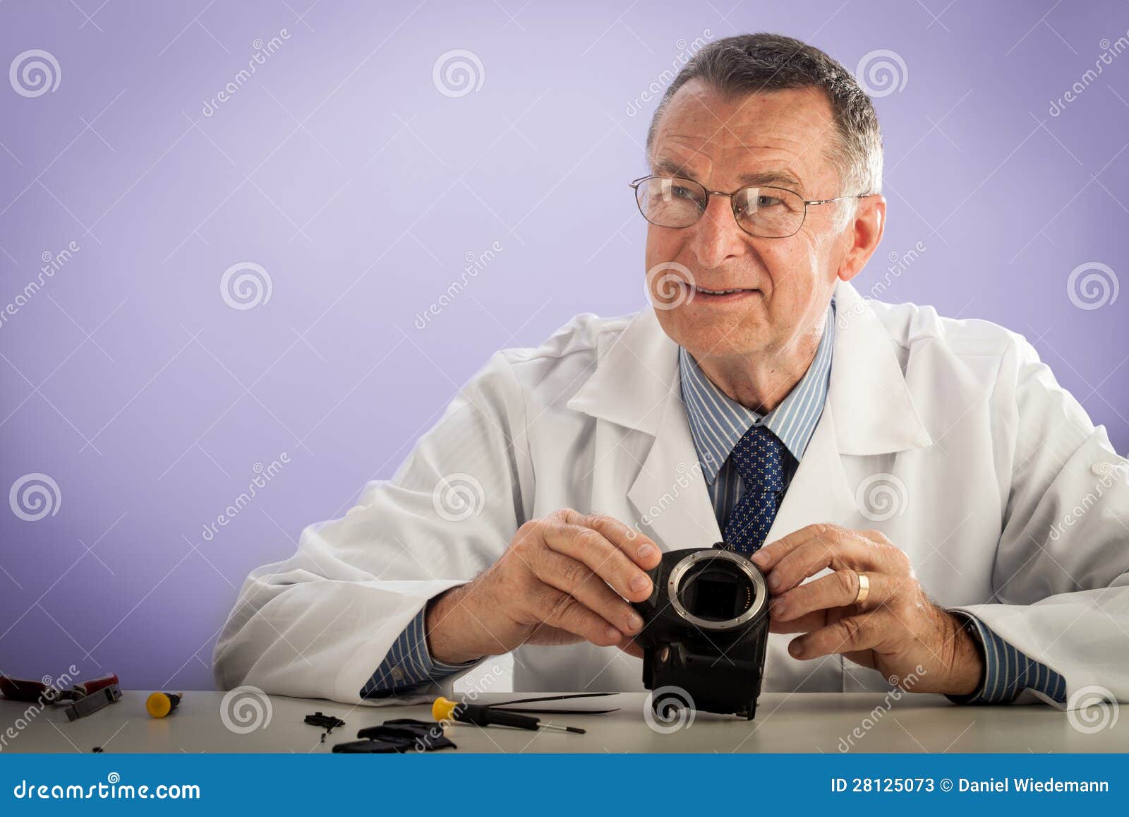 Smiling Man Fixing Camera stock image. Image of electrician - 28125073