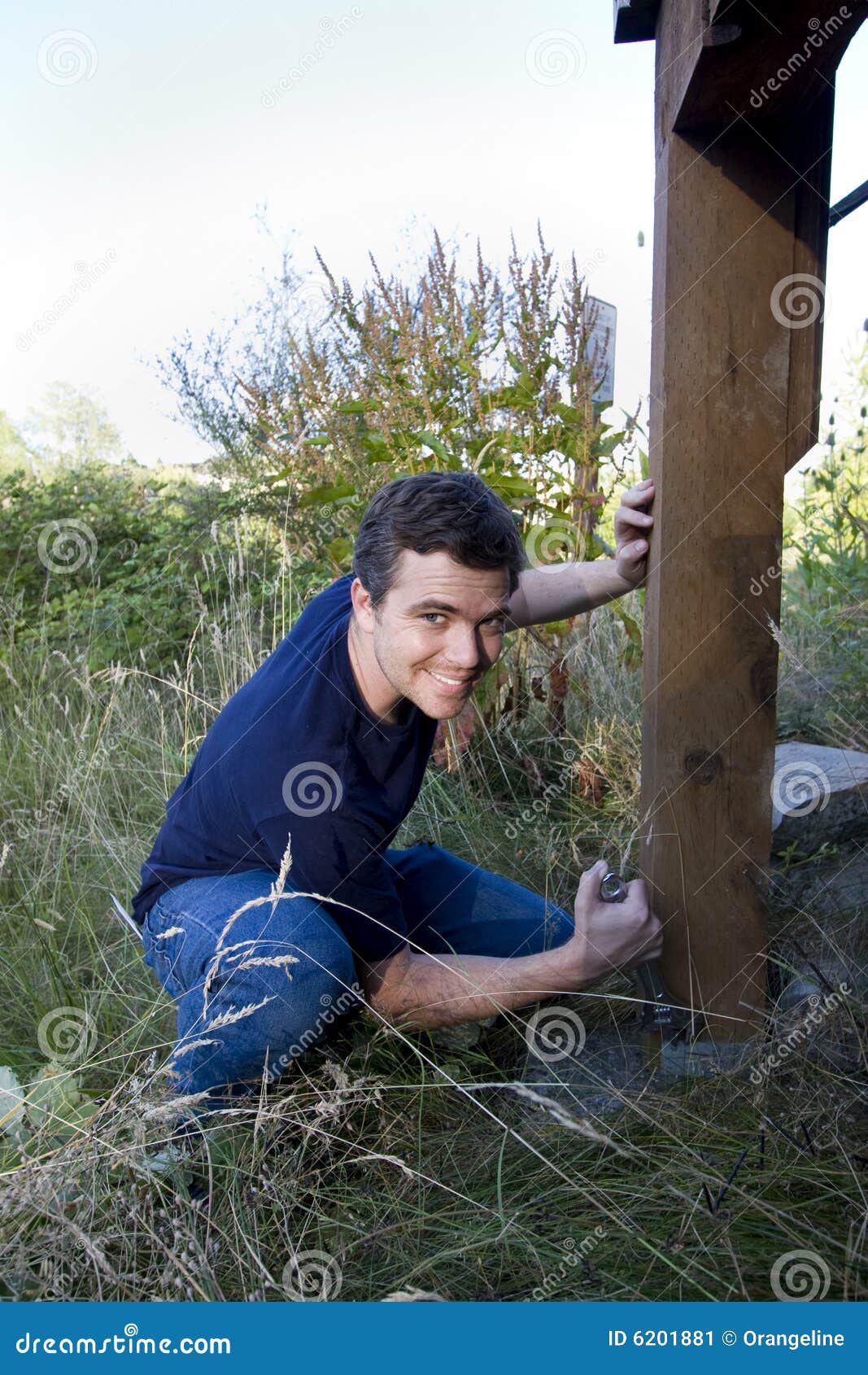 Smiling Man Fixing House - Vertical Stock Image - Image of smile ...