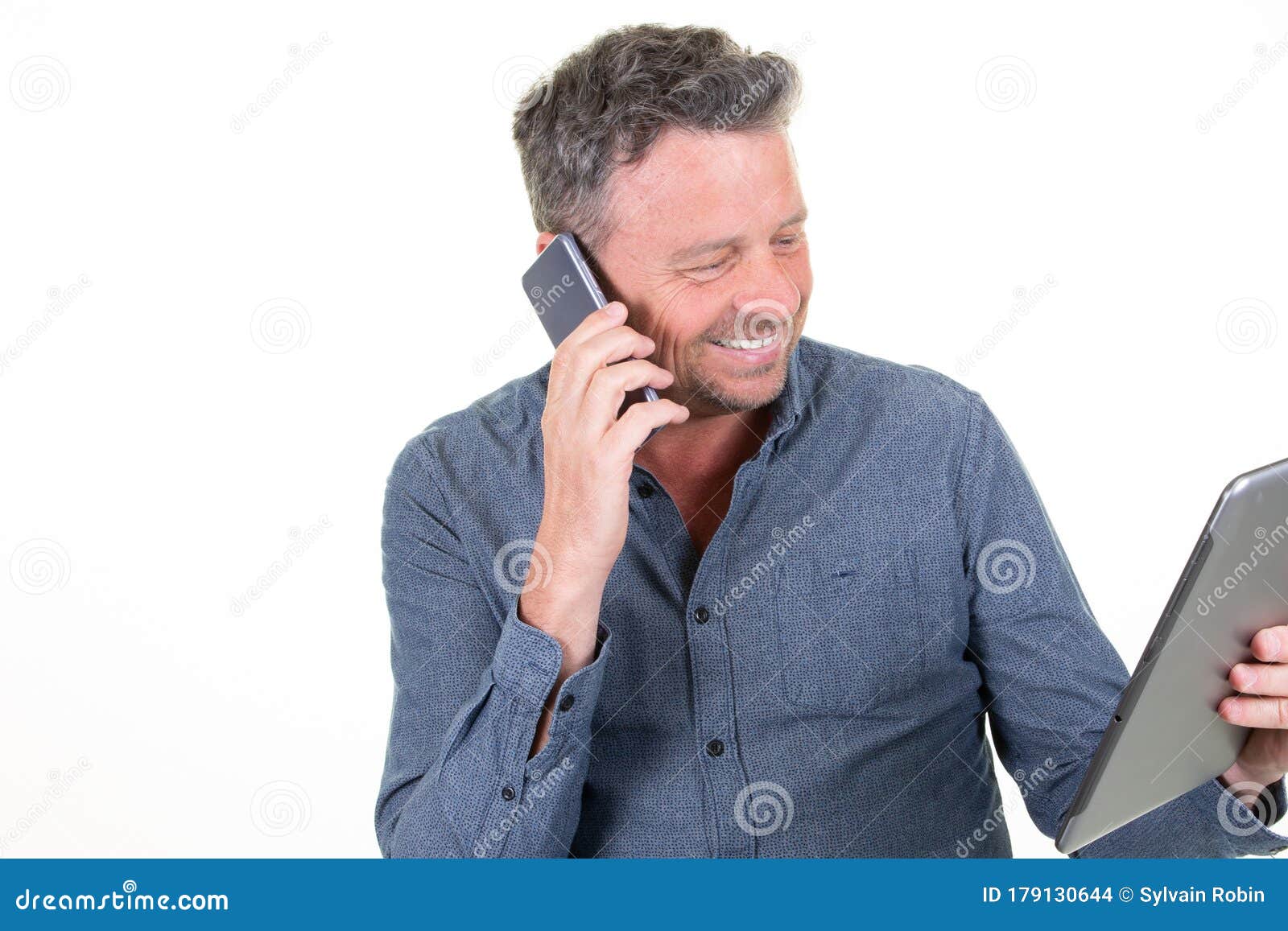 Smiling Man Happy Handsome Businessman Using Tablet Computer while ... Smiling Man Happy Handsome Businessman Using Tablet Computer while ...
