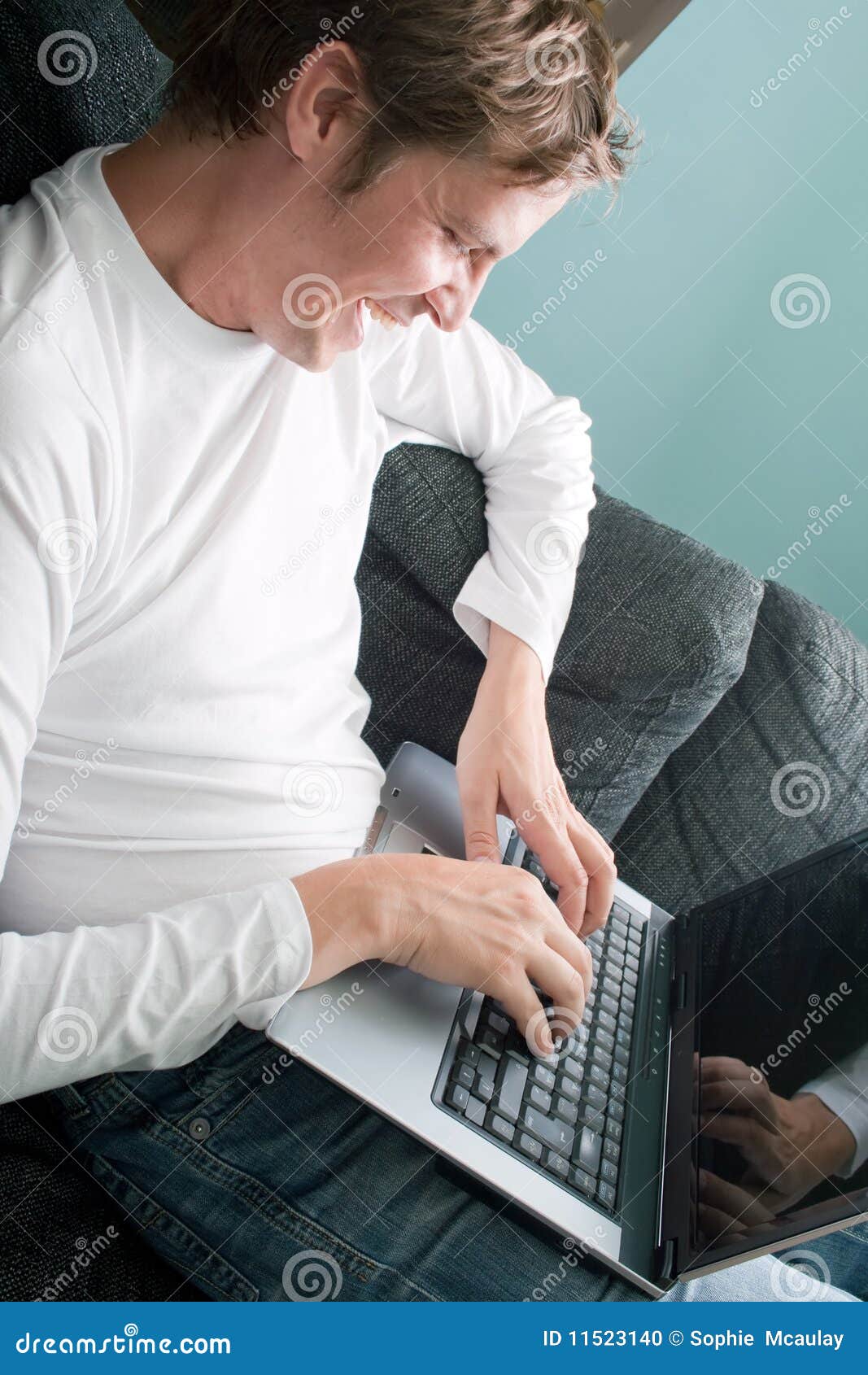 Smiling Man Having Fun on Laptop Computer Stock Photo - Image of person ...
