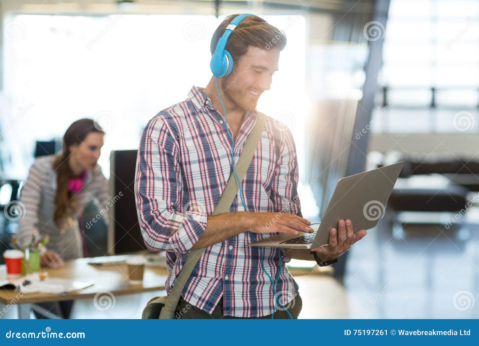 Smiling Man with Headphone Using Laptop Stock Image - Image of ...