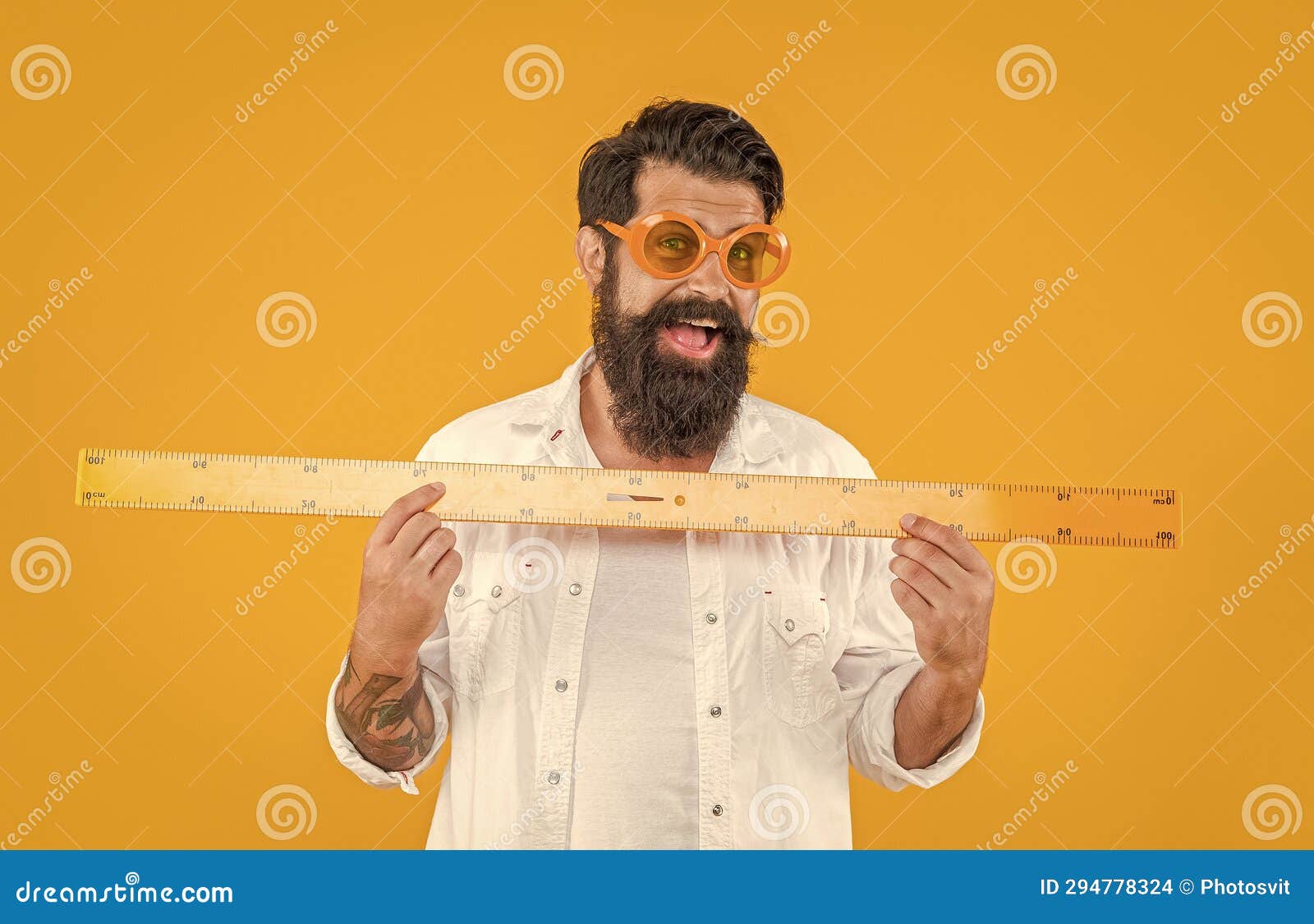 Smiling Man Hold Geometry Ruler on Background. Photo of Man Hold ...