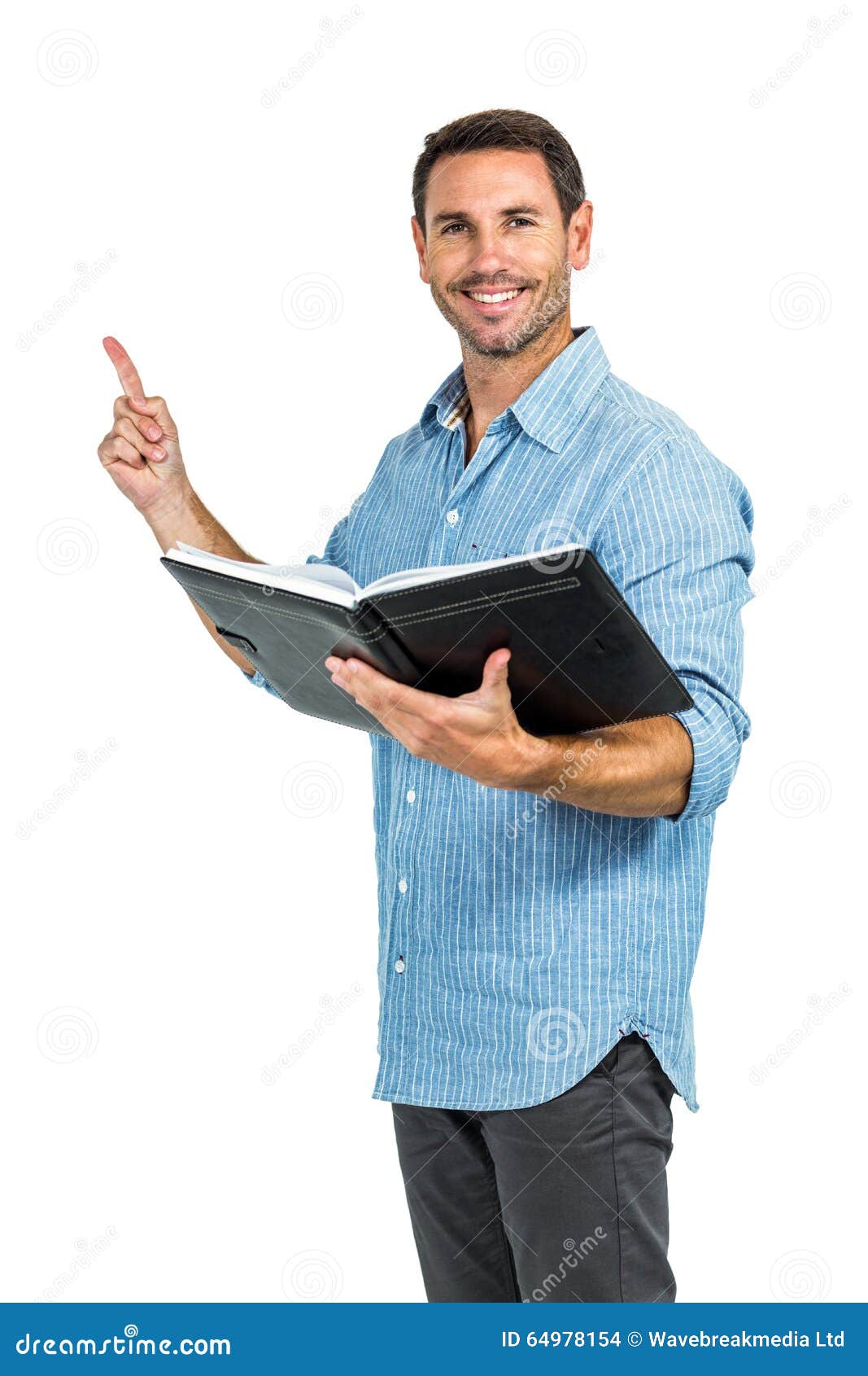 Smiling Man Holding a Book and Pointing Up Stock Photo - Image of ...