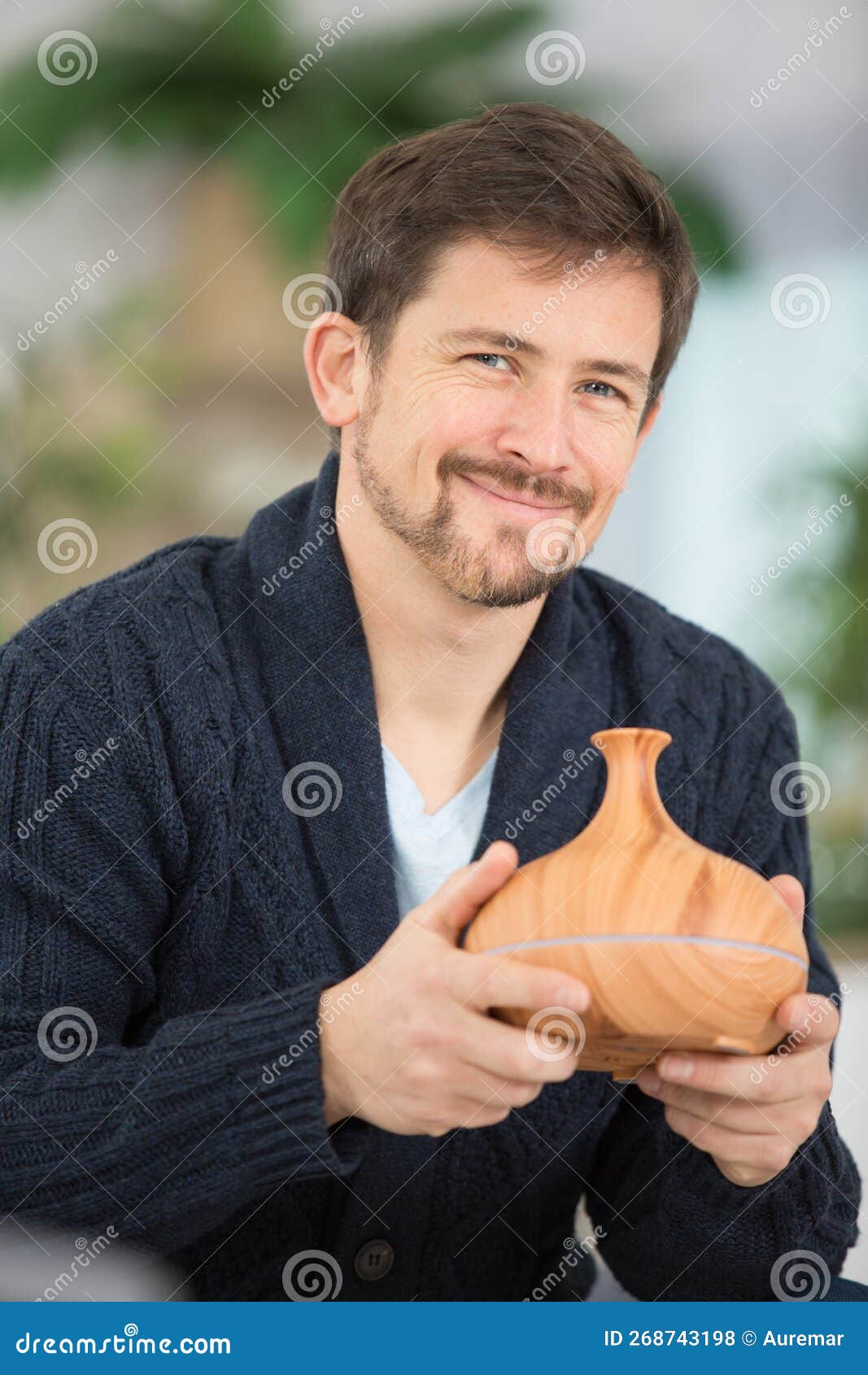 Smiling Man Holding Diffuser for Essential Oils Stock Photo - Image of ...