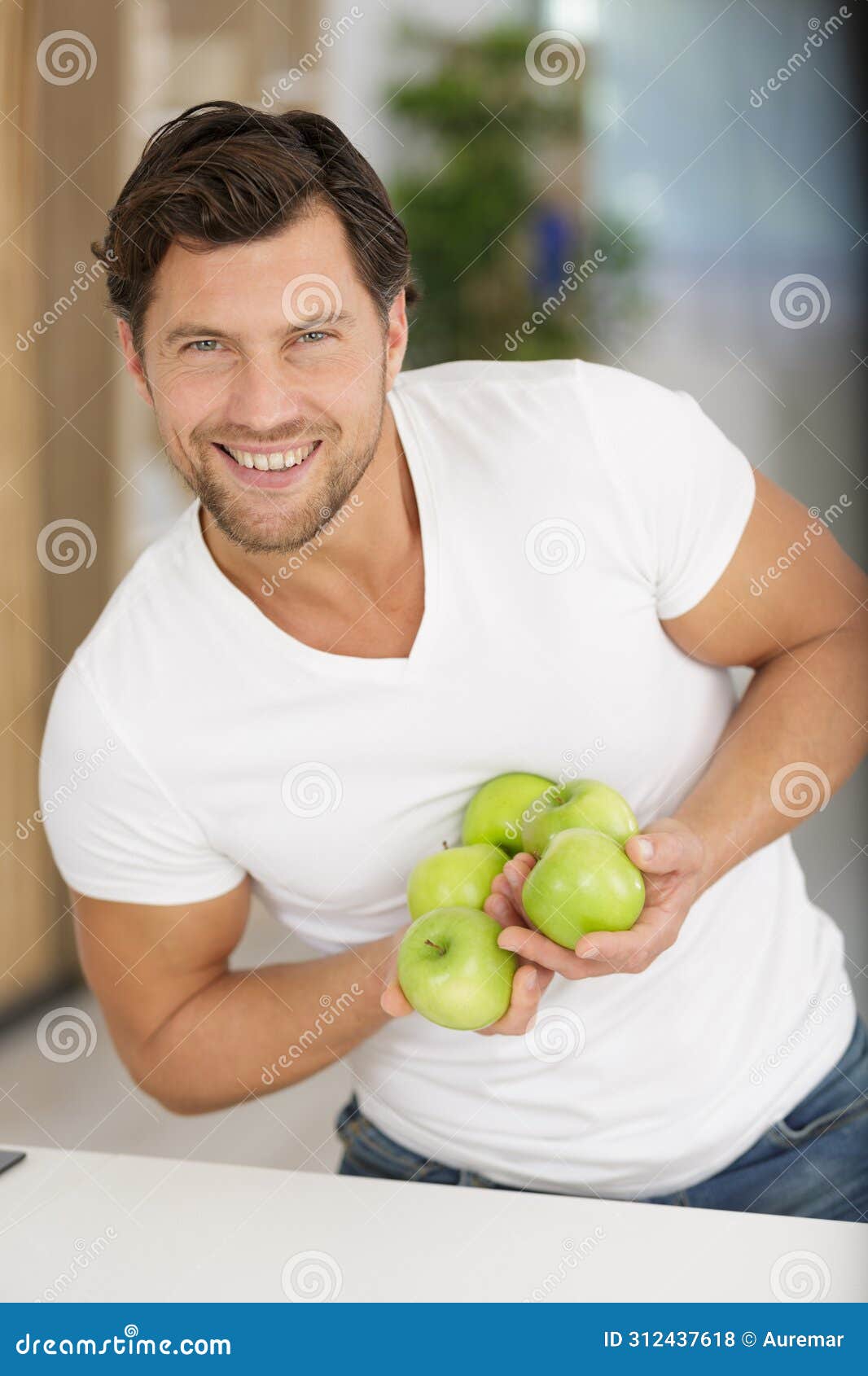 Smiling Man Holding Green Apples Stock Photo - Image of diet, male ...