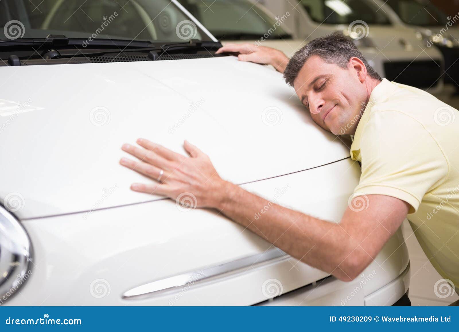 Smiling Man Hugging a White Car Stock Image - Image of indoors ...
