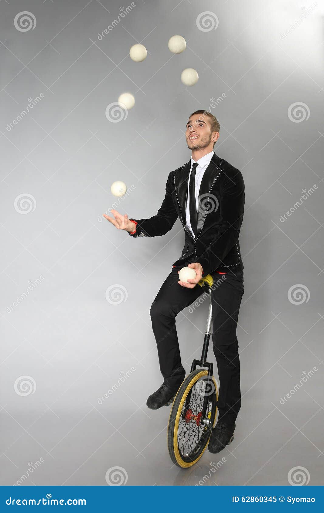 Smiling man juggles balls stock image. Image of happy - 62860345