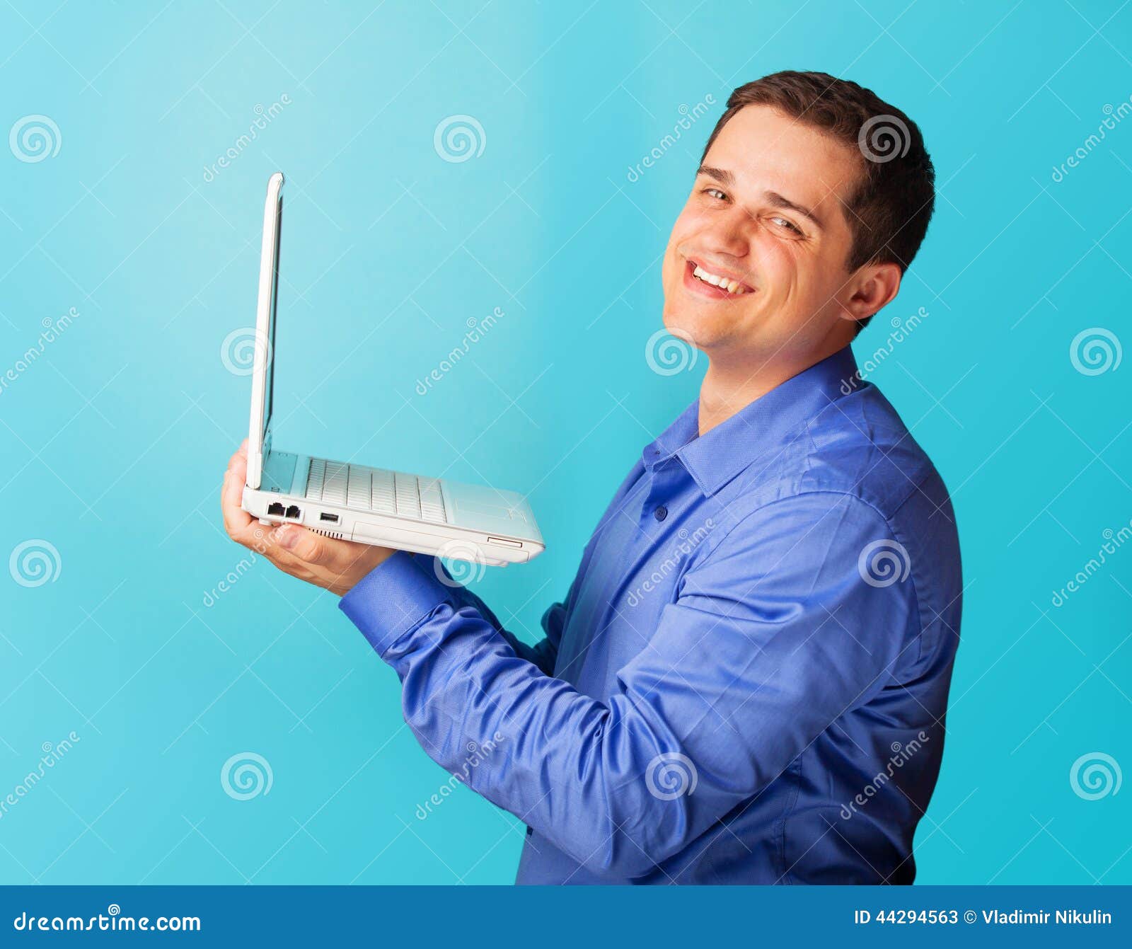 Smiling man with laptop stock image. Image of background - 44294563