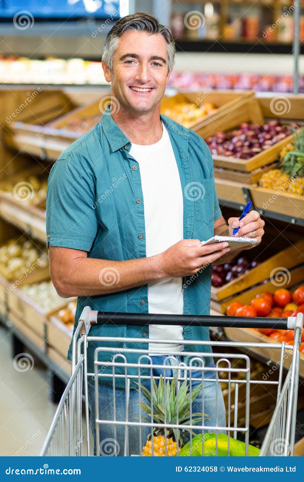 Smiling Man Looking at His List Stock Photo - Image of food, market ...