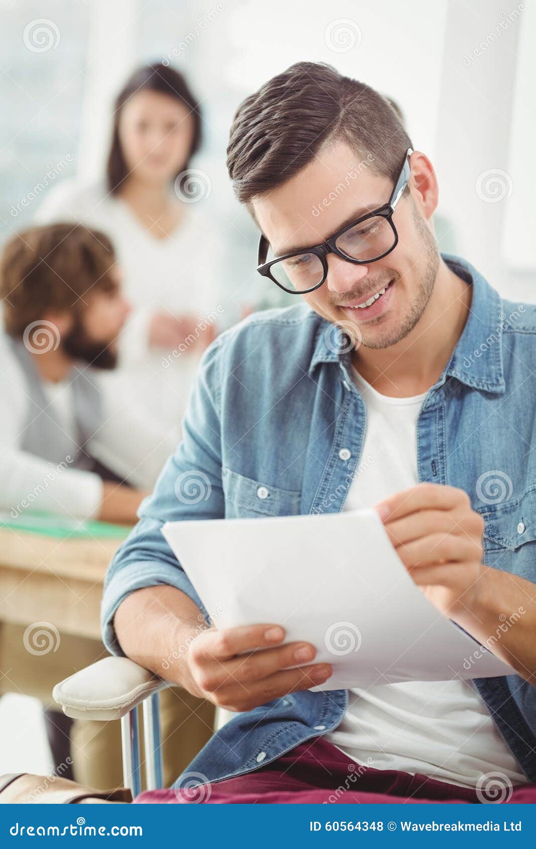 Smiling Man Looking at Paper Stock Photo - Image of caucasian, people ...