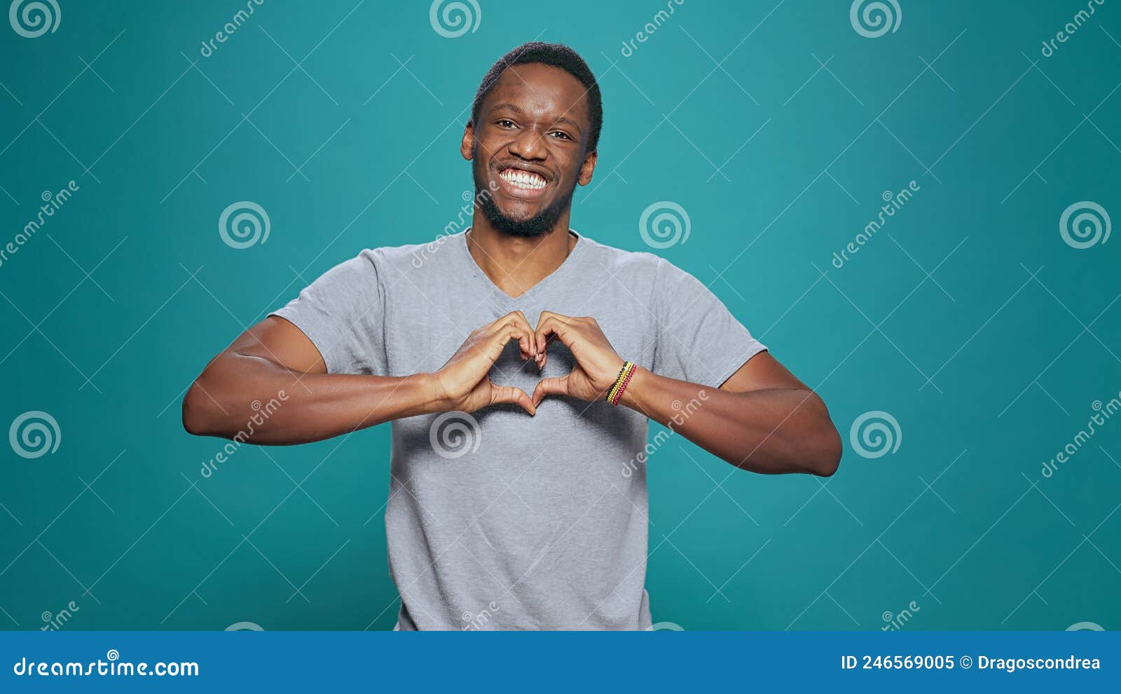 Smiling Man Making Heart Shape Sign with Hands in Front of Camera Stock ...