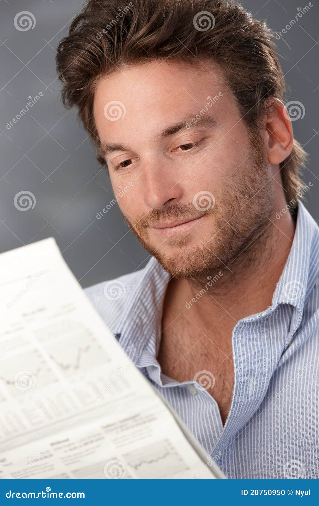 Smiling man with newspaper stock photo. Image of read - 20750950