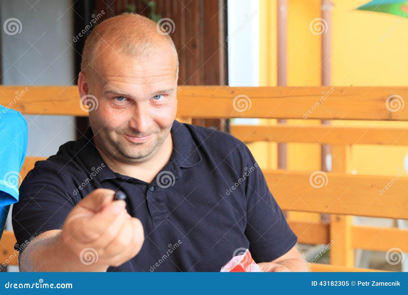 Smiling man offering candy stock image. Image of sweetmeat - 43182305