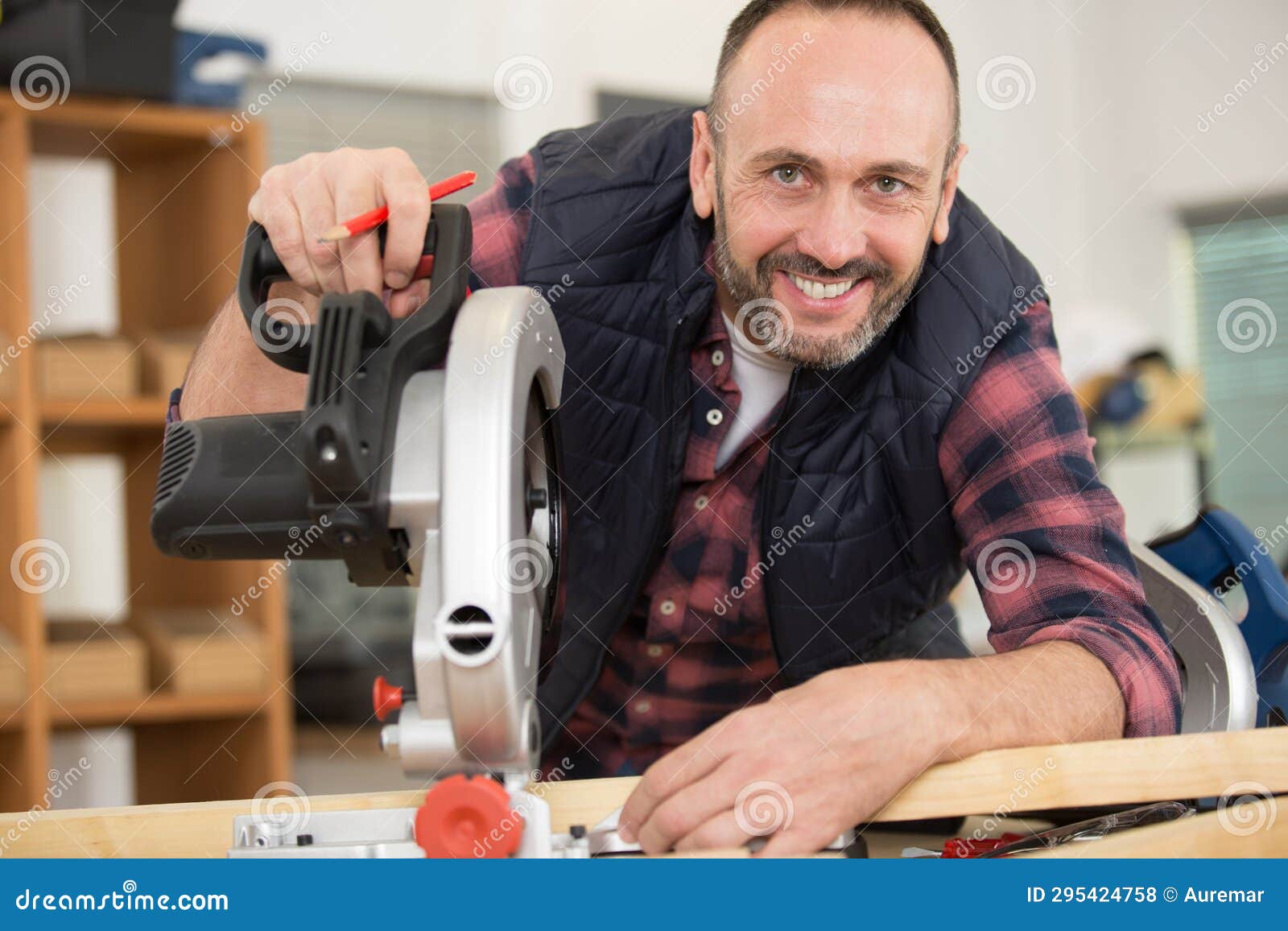 Smiling Man Operating Circular Saw in Wood Workshop Stock Photo - Image ...