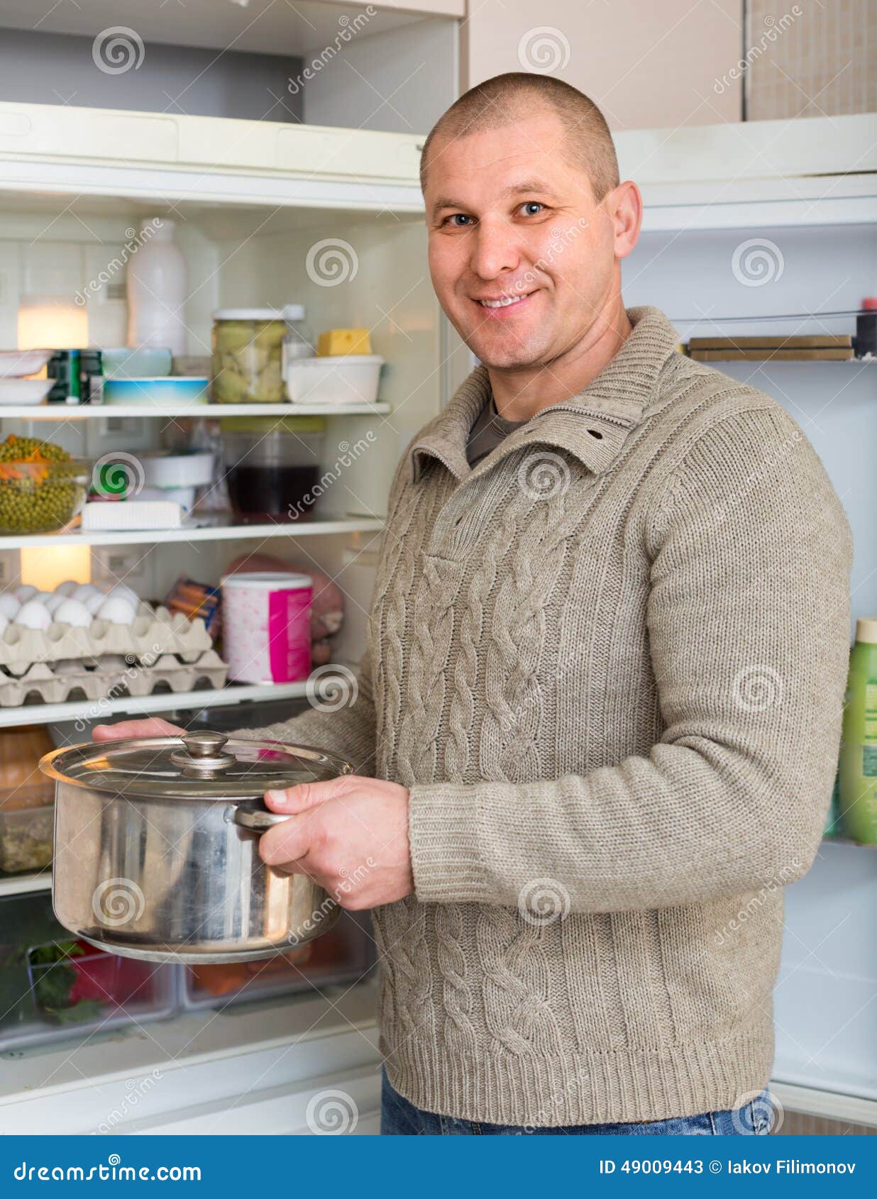 Smiling Man with Pan Near Fridge Stock Image - Image of food, look ...