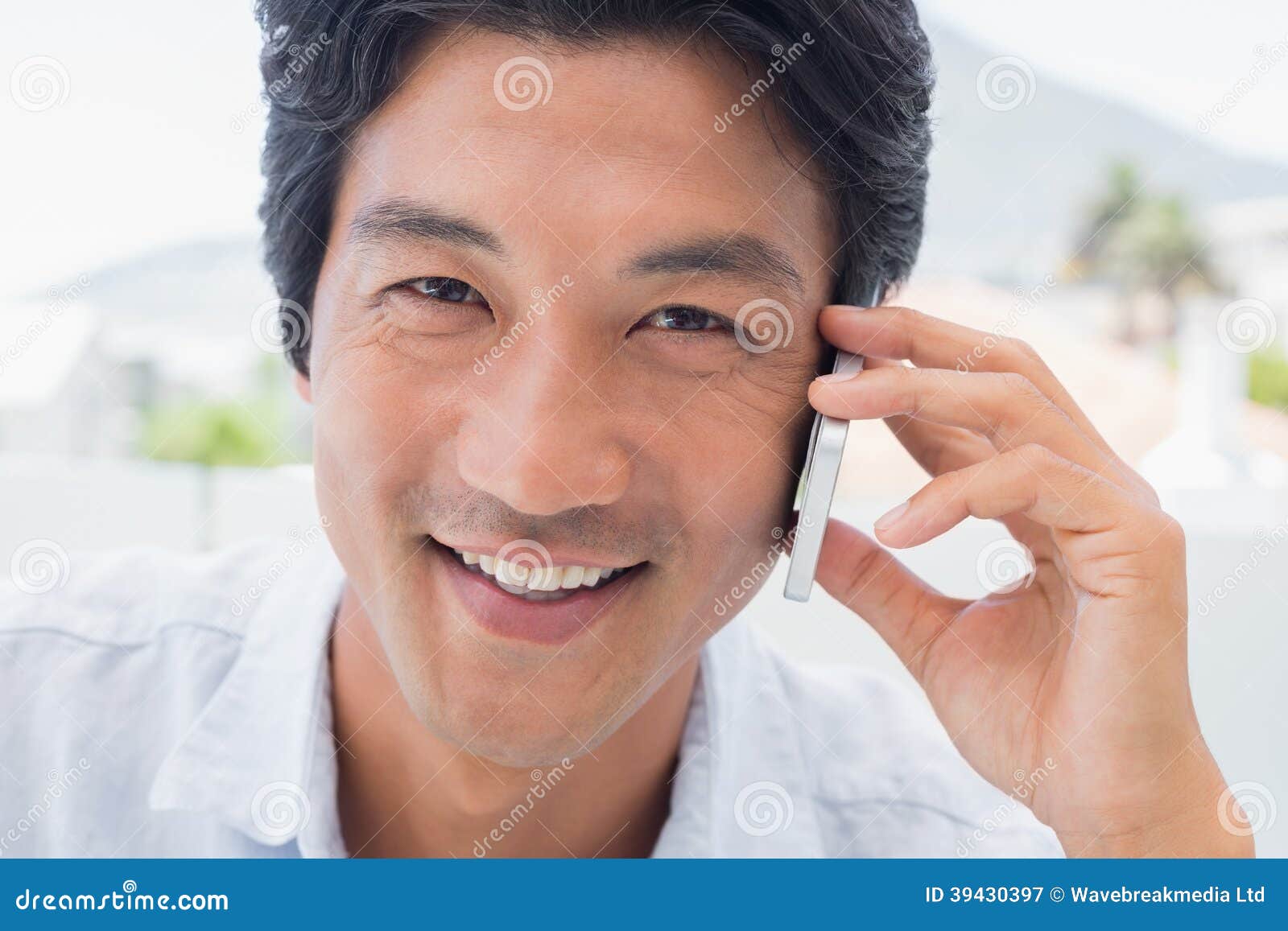 Smiling man on phone call stock image. Image of asian - 39430397