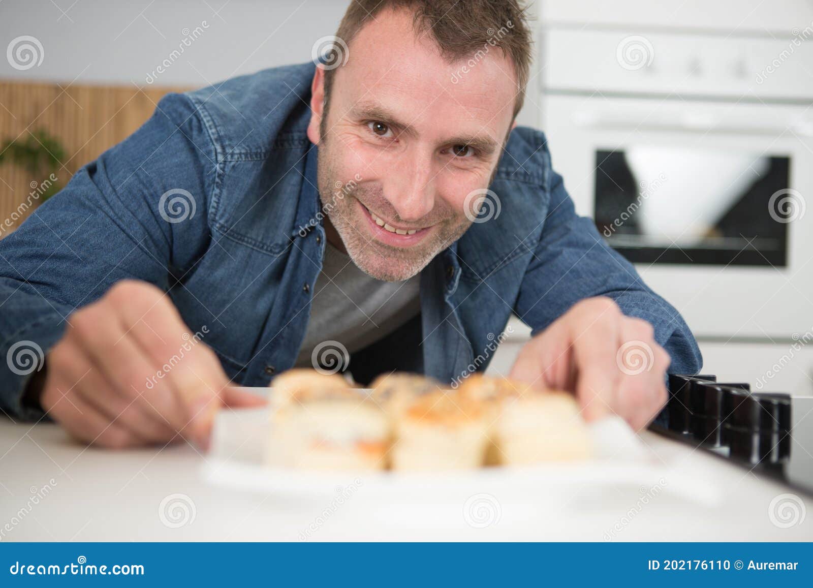 Smiling Man with Plate Finger Food Stock Photo - Image of traditions ...