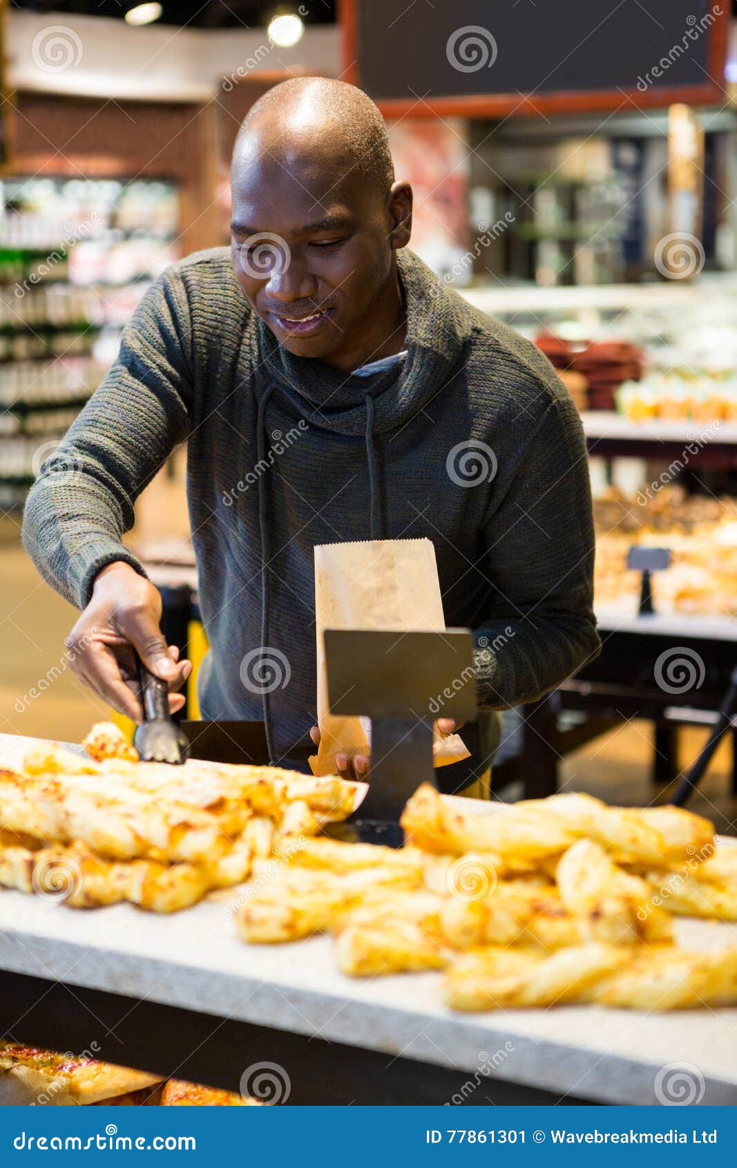 Smiling Man Purchasing Bread Stock Image - Image of holding, buying ...