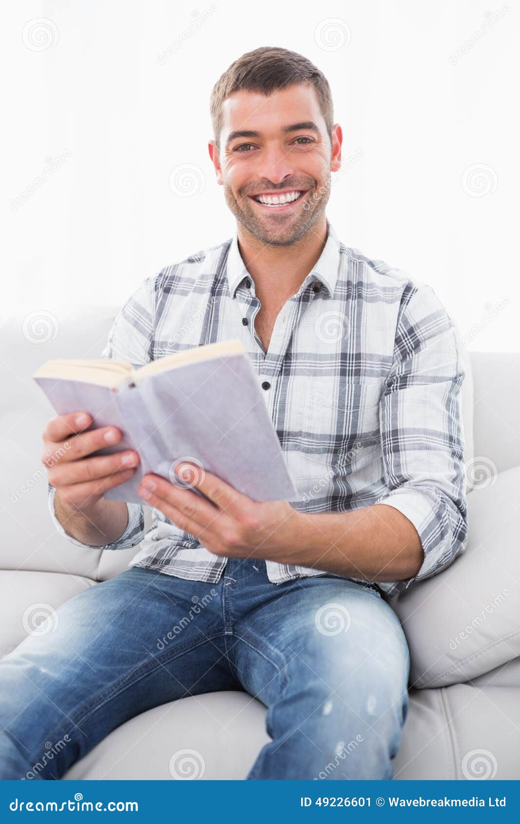 Smiling man reading a book stock image. Image of book - 49226601