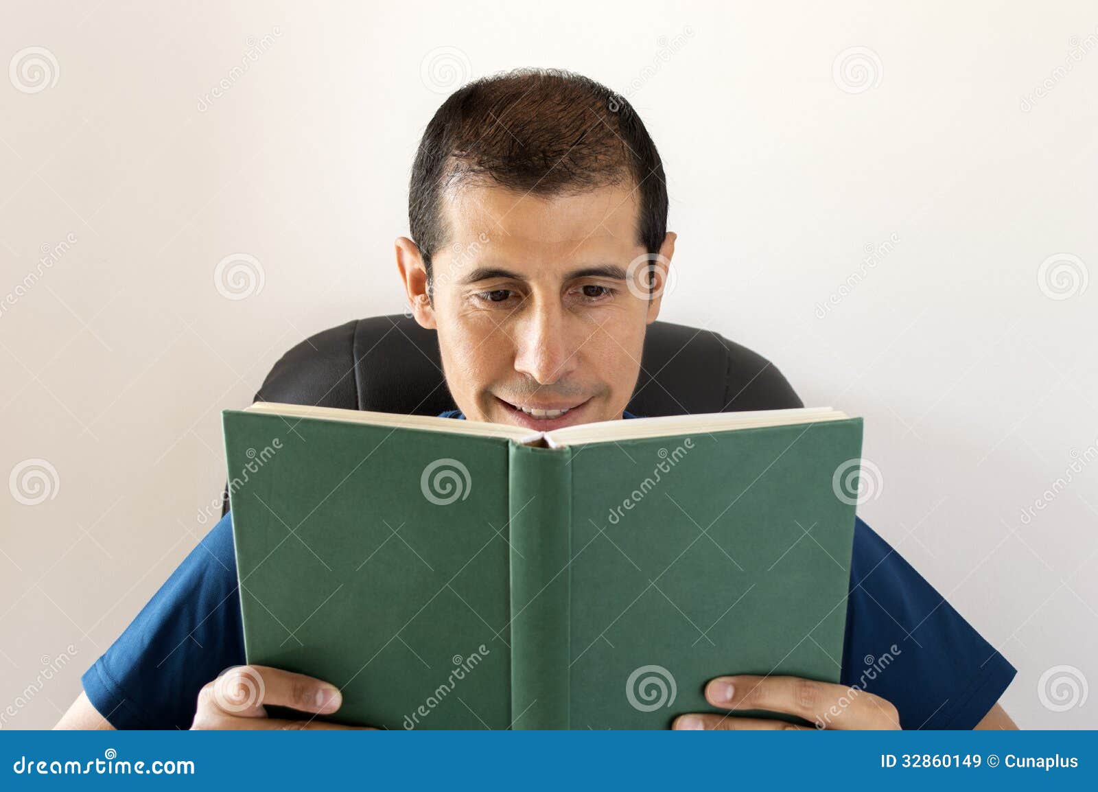 Smiling man reading a book stock image. Image of leisure - 32860149