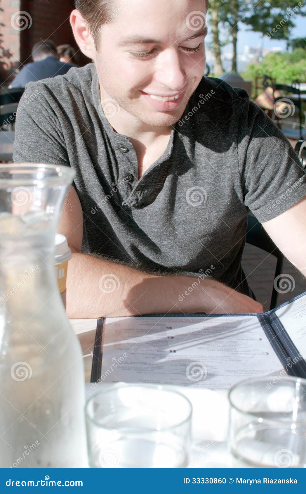 Smiling Man Reading Menu in Restaurant Stock Photo - Image of european ...