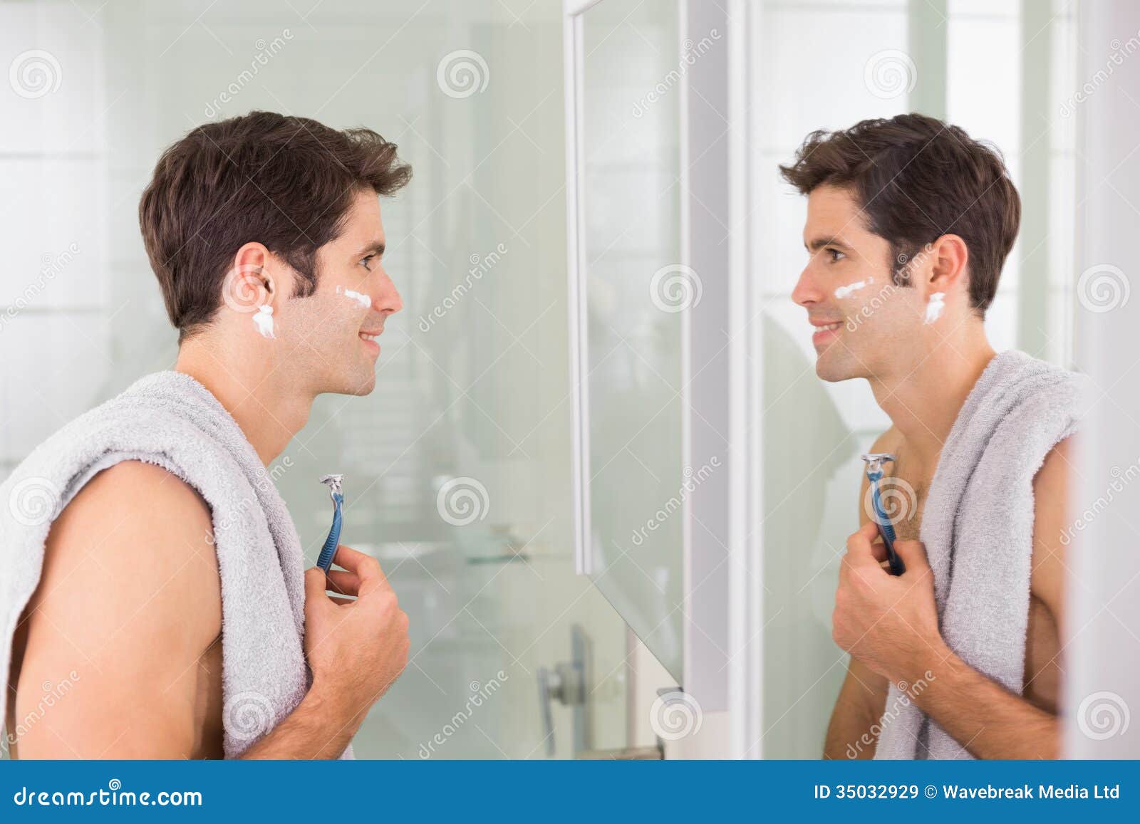 Smiling Man with Reflection Shaving in Bathroom Stock Image - Image of ...