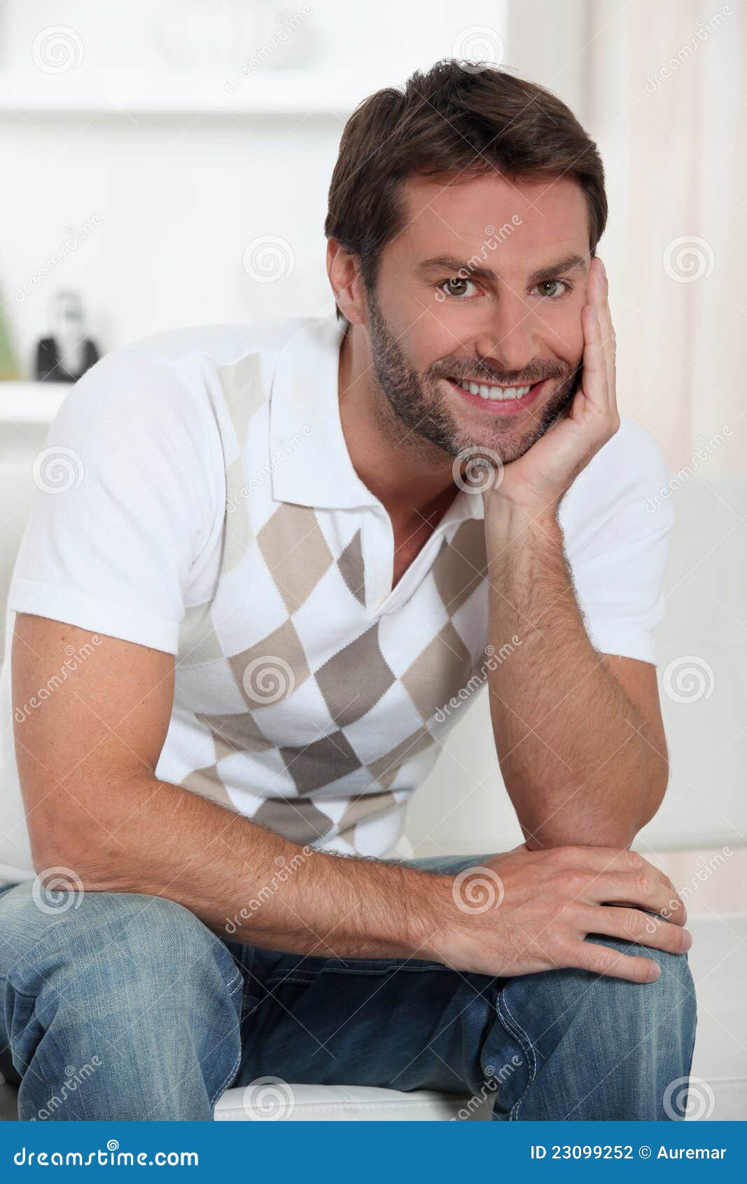 Smiling Man Relaxing at Home Stock Photo - Image of indoors, single ...
