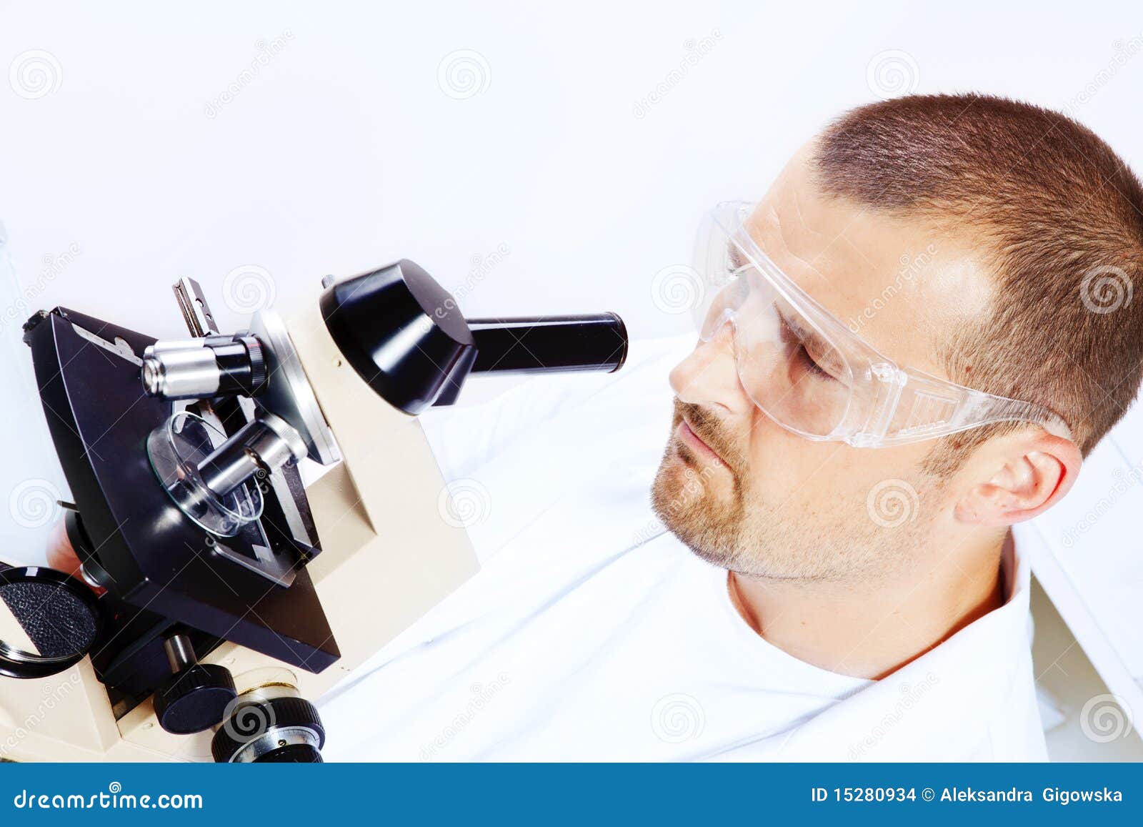 Smiling Man Researching on a Microscope Stock Photo - Image of person ...