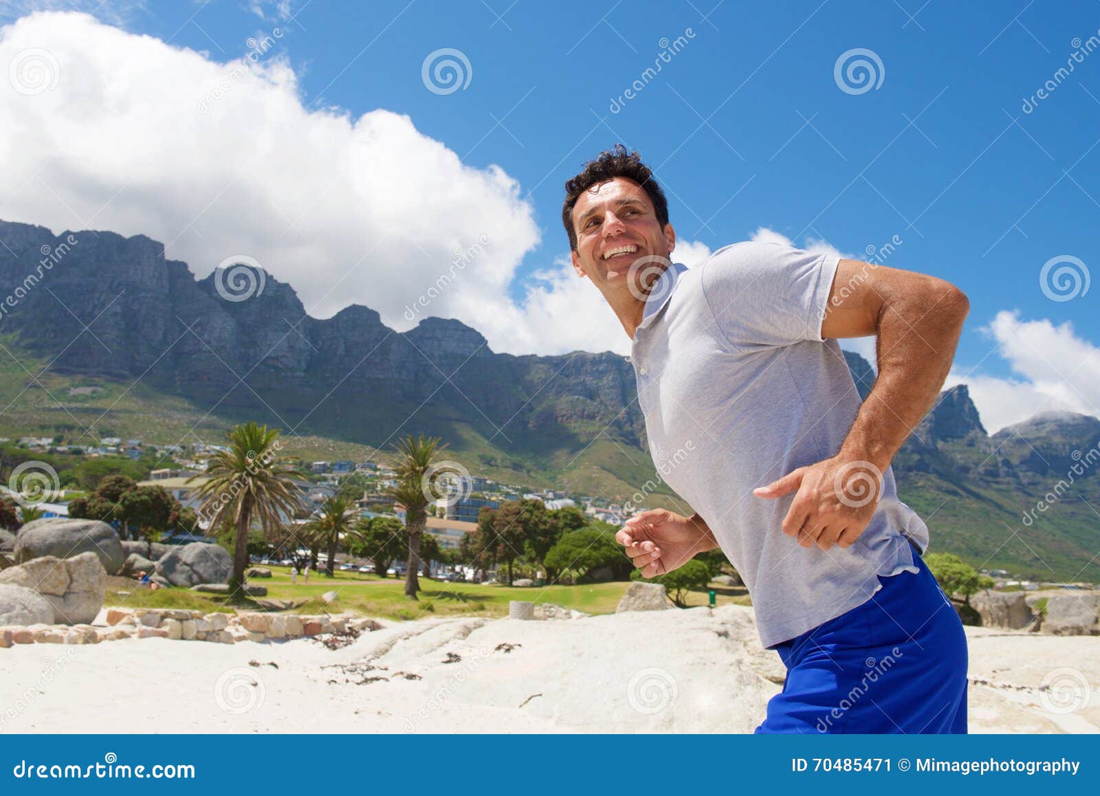 Smiling Man Running at the Beach Stock Image - Image of beauty, mature ...
