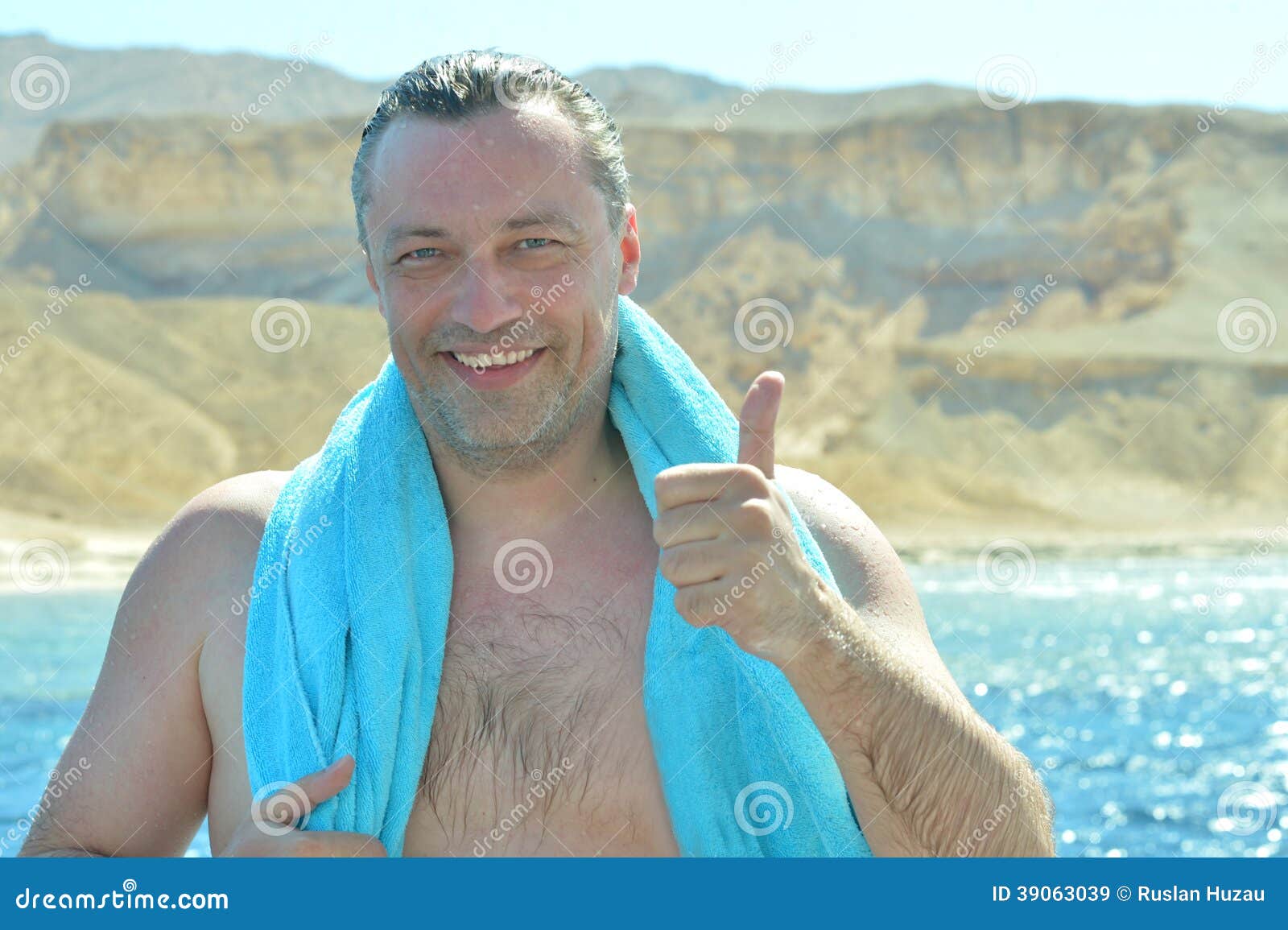 Smiling man on sea beach stock image. Image of person - 39063039