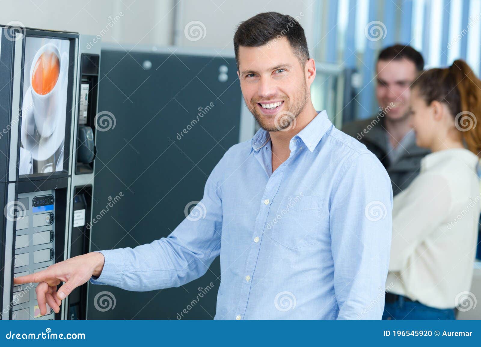 Smiling Man Selecting Drink at Vending Machine Stock Photo - Image of ...