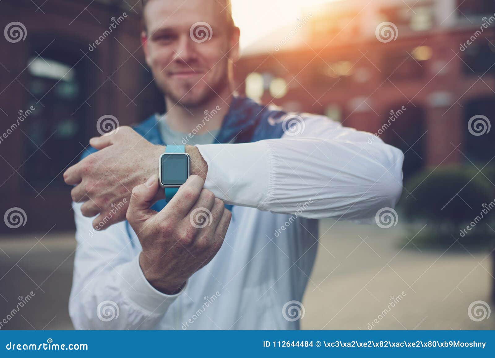 Smiling Man Showing His Smart Watches on the Wrist Stock Photo - Image ...