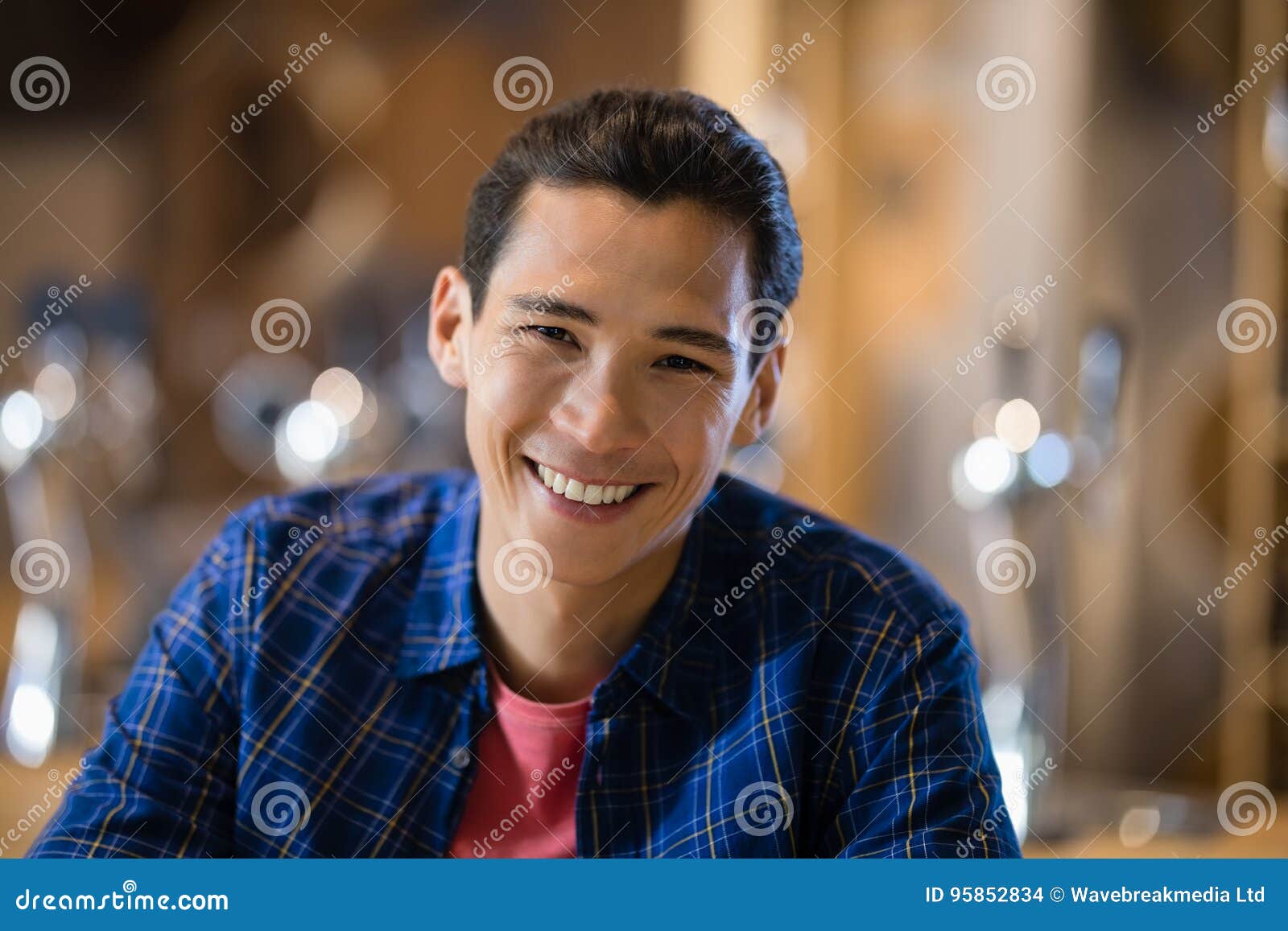Smiling man sitting in bar stock photo. Image of enjoyment - 95852834