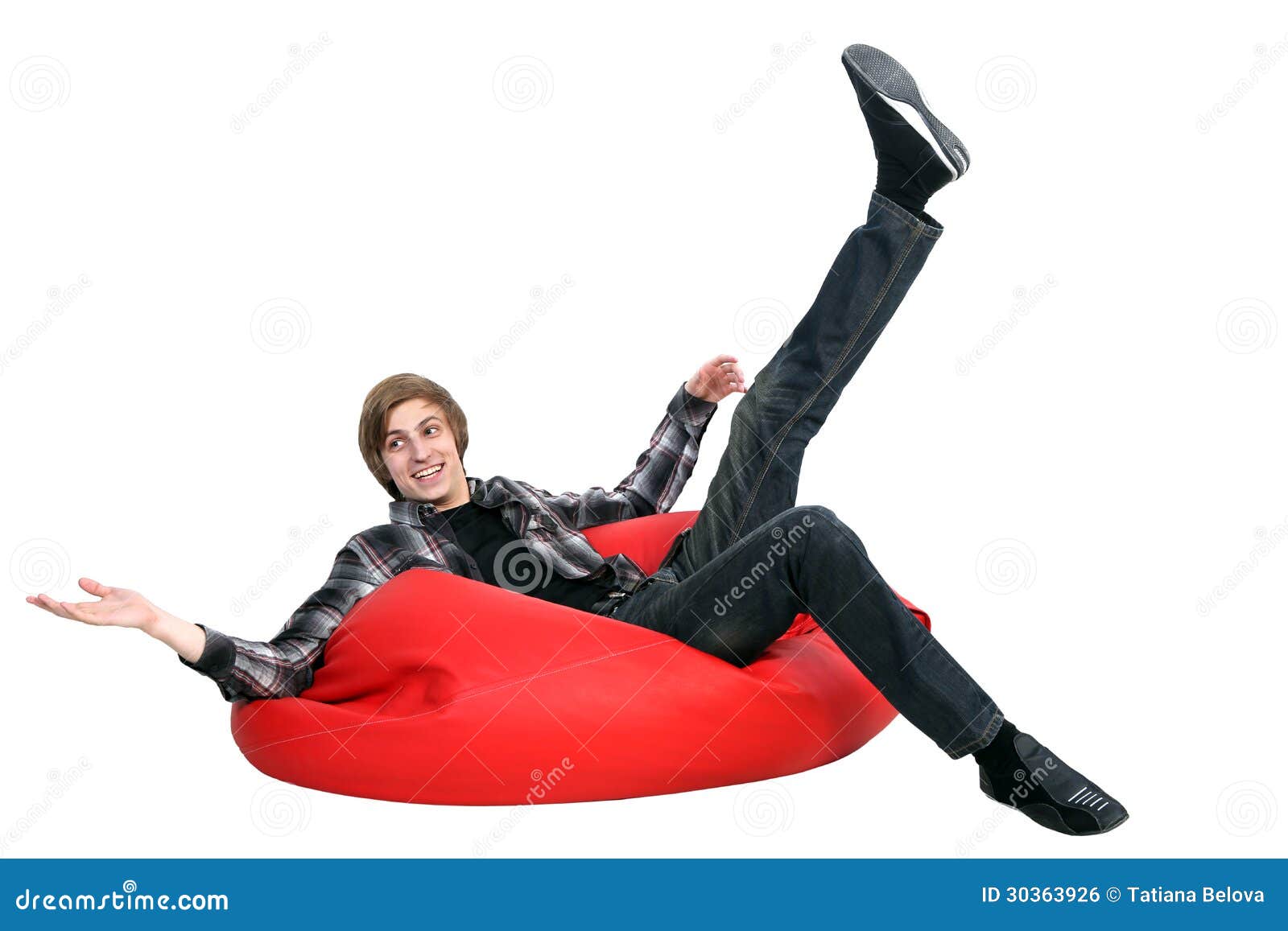 Smiling Man Sitting on Bean Bag Stock Photo - Image of lifestyle ...