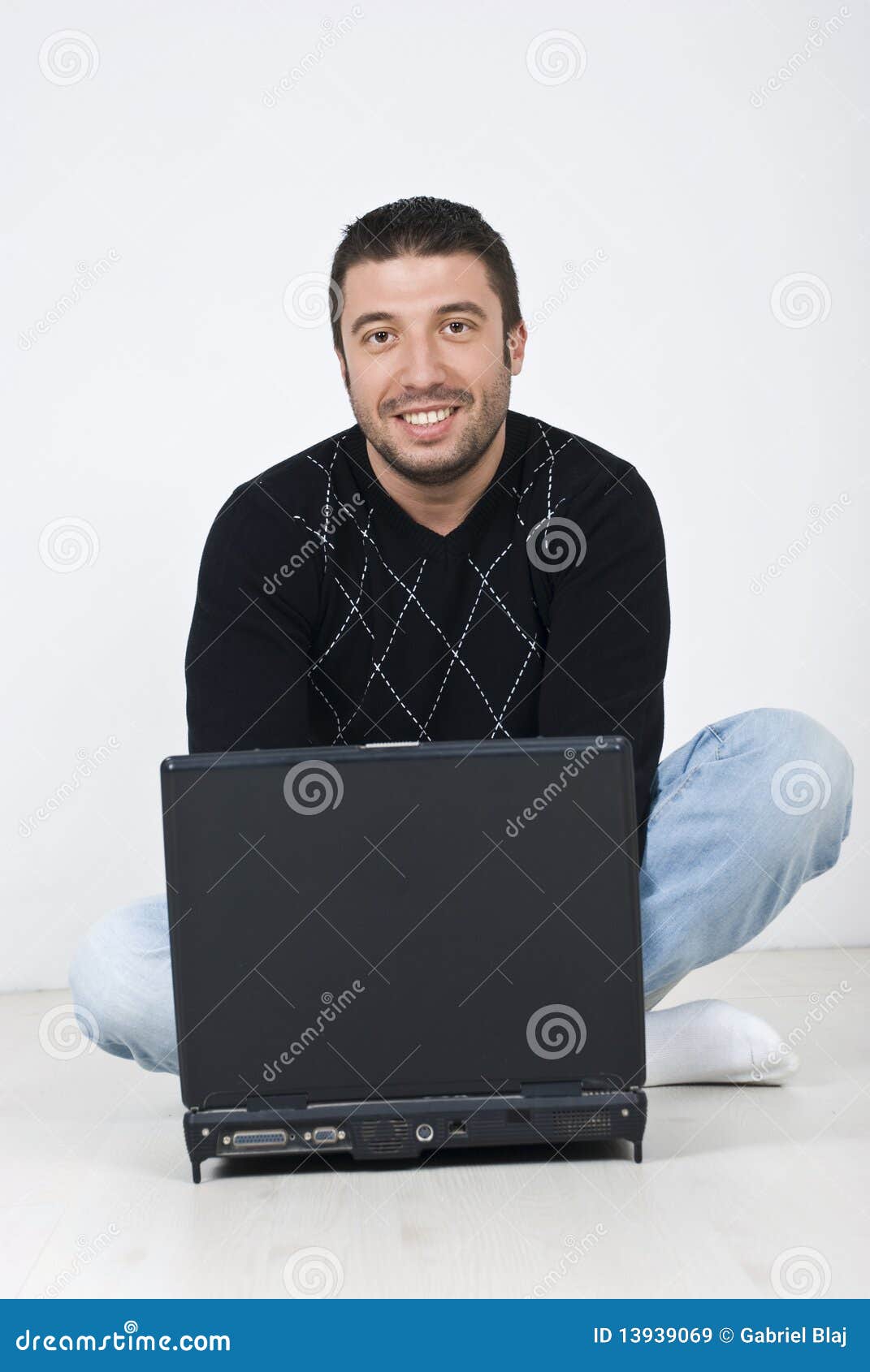 Smiling Man Sitting on Floor with a Laptop Stock Image - Image of close ...