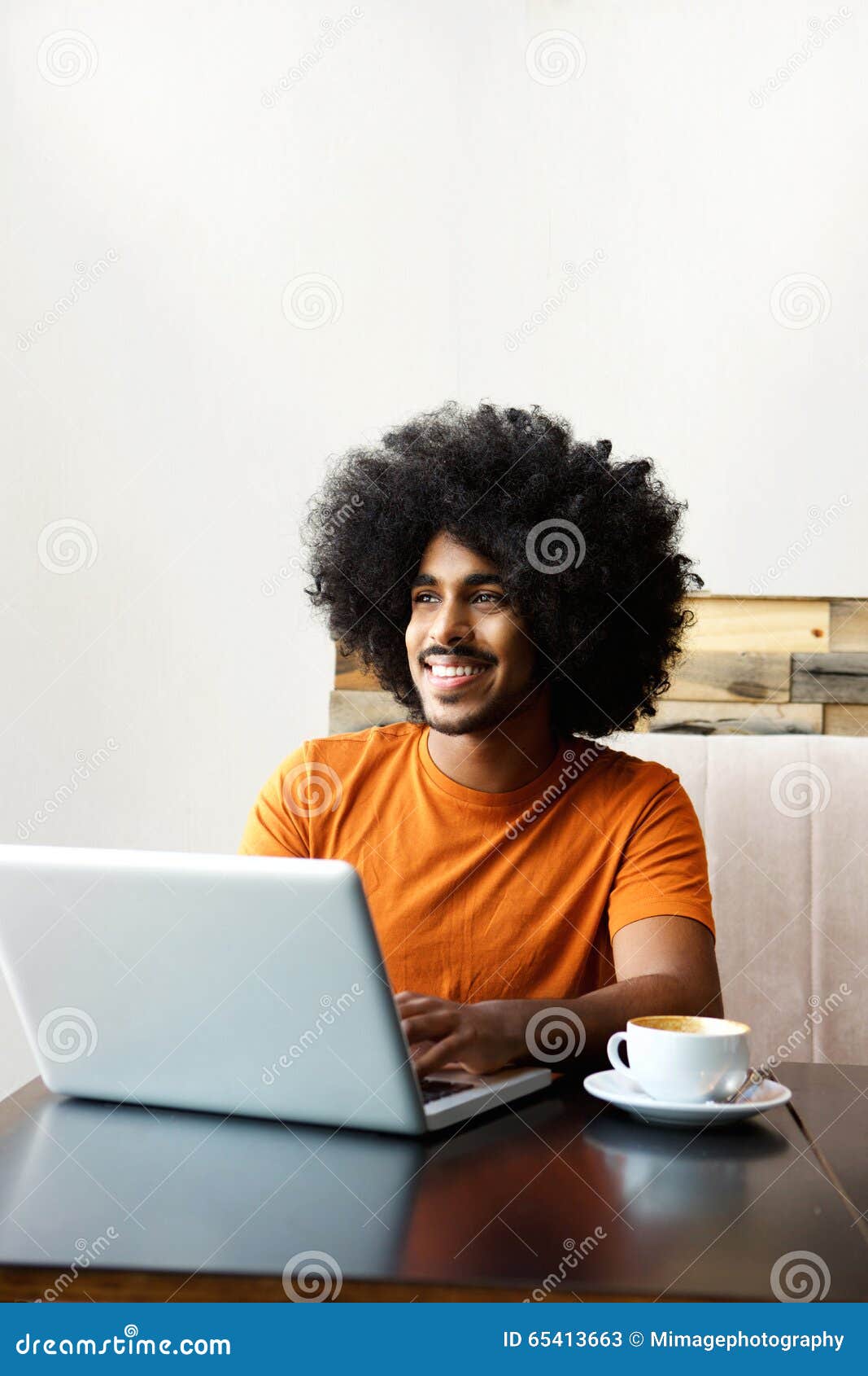 Smiling Man Sitting at Table with Laptop Stock Image - Image of ...