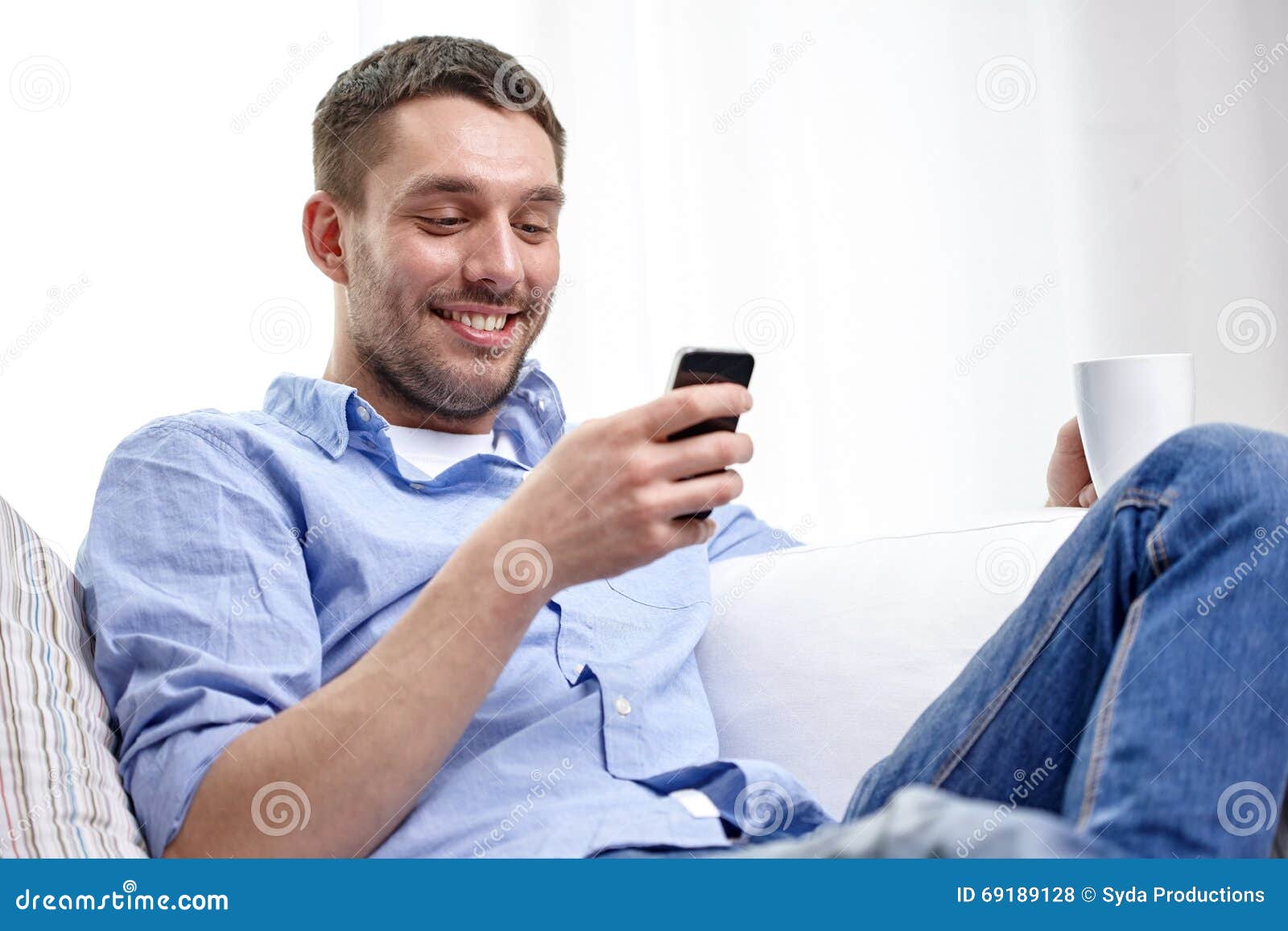 Smiling Man with Smartphone at Home Stock Photo - Image of gadget ...