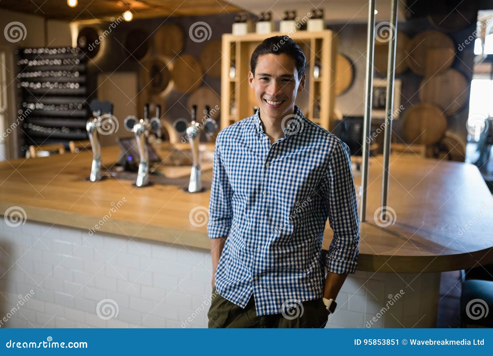 Smiling Man Standing at Counter in Restaurant Stock Image - Image of ...