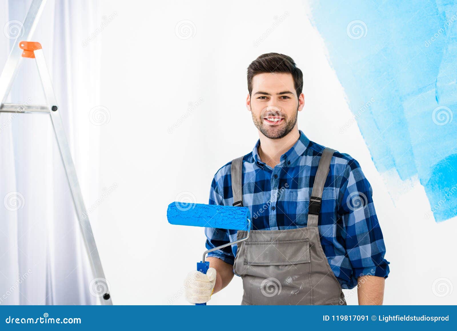 Smiling Man Standing with Paint Roller Brush and Looking Stock Image ...