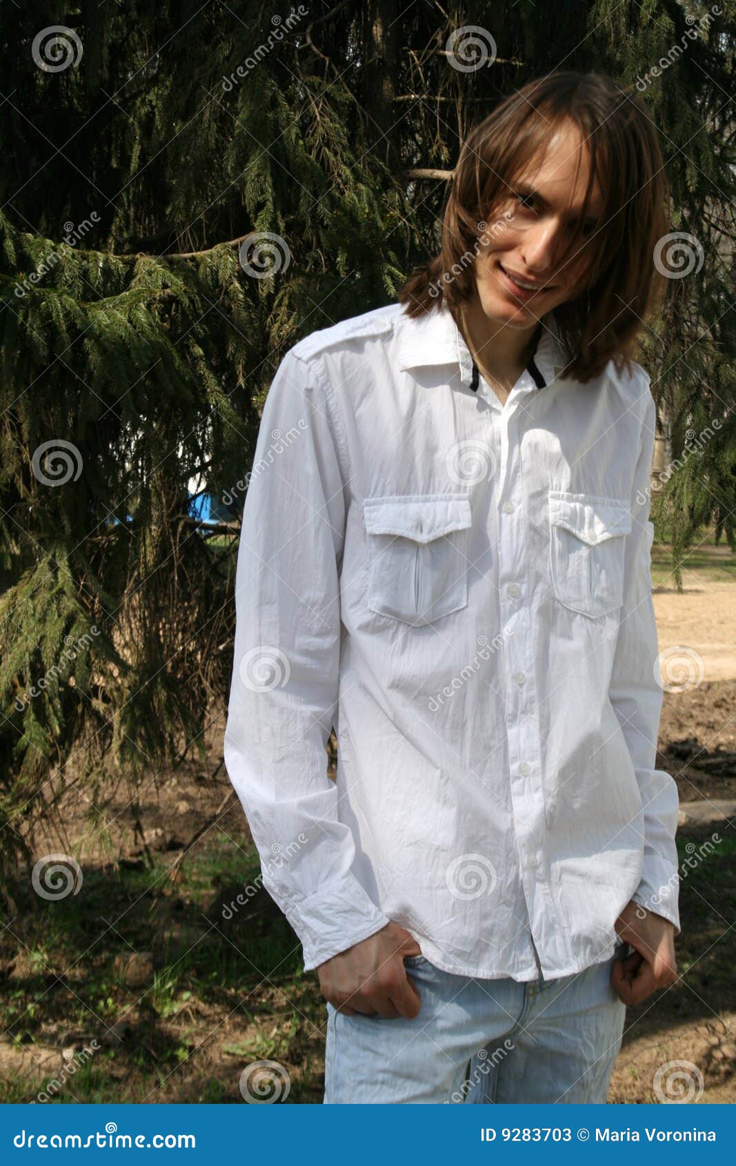 Smiling Man Standing Under a Fir Tree Stock Image - Image of casual ...