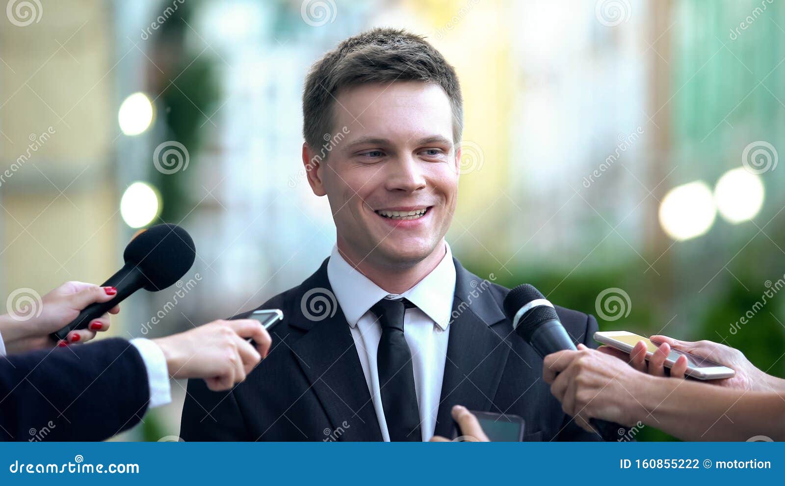 Smiling Man in Suit Giving Interview To Journalists, Evening News ... Smiling Man in Suit Giving Interview To Journalists, Evening News ...