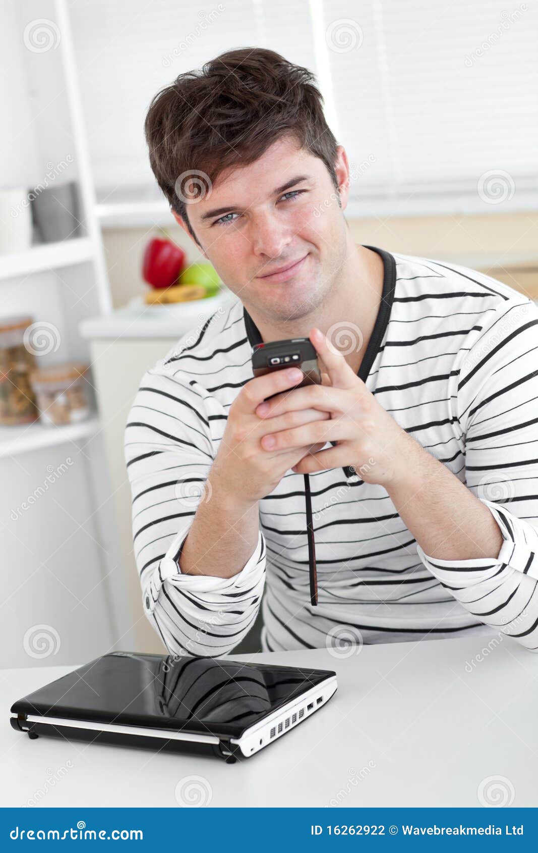 Smiling Man Texting with His Cellphone at Home Stock Photo - Image of ...